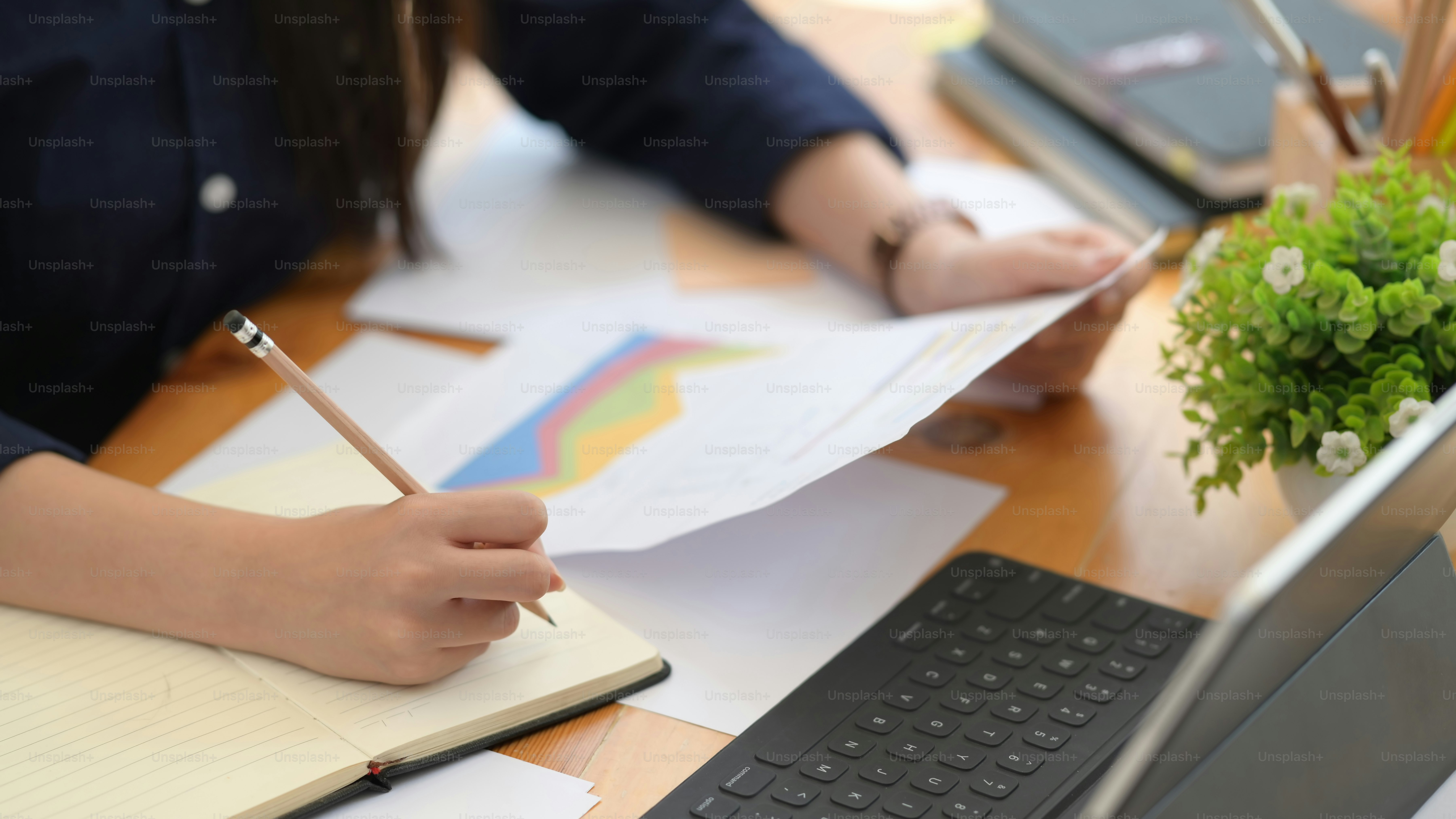 Businesswoman working with documents and tablet computer photo ...