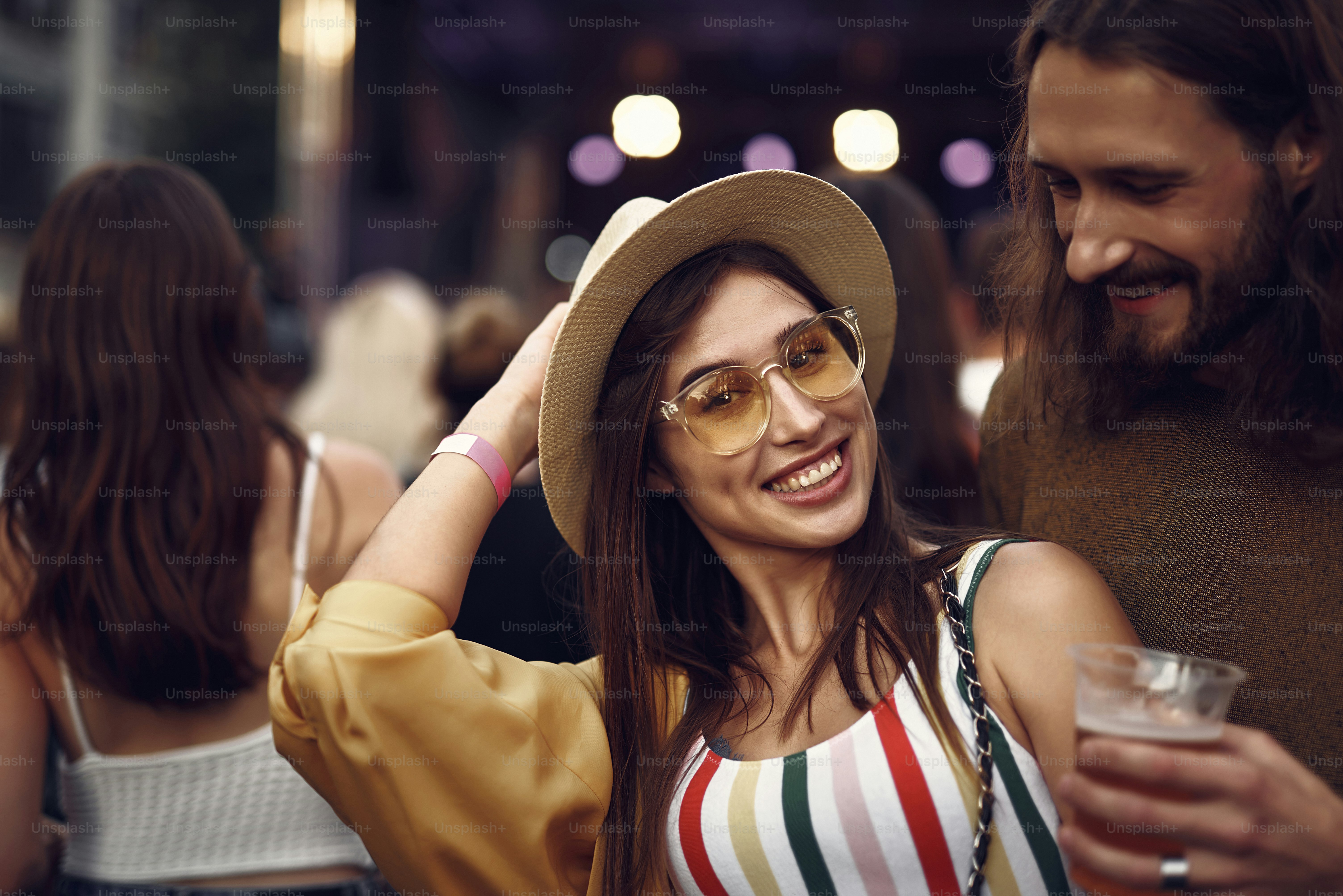 Portrait of young couple enjoying company of each other while visiting ...