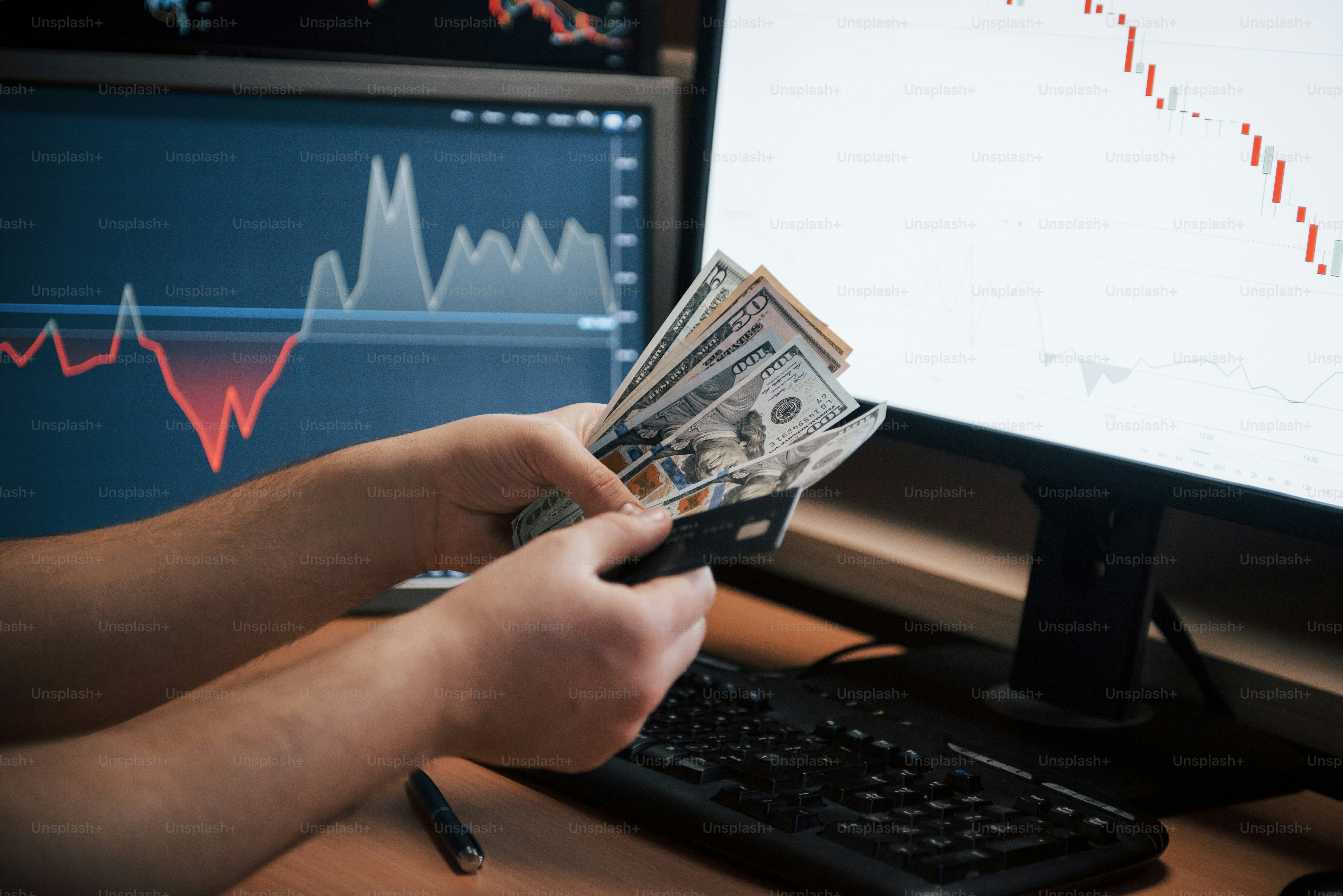 Close up view of human hands holds money in the office with multiple ...