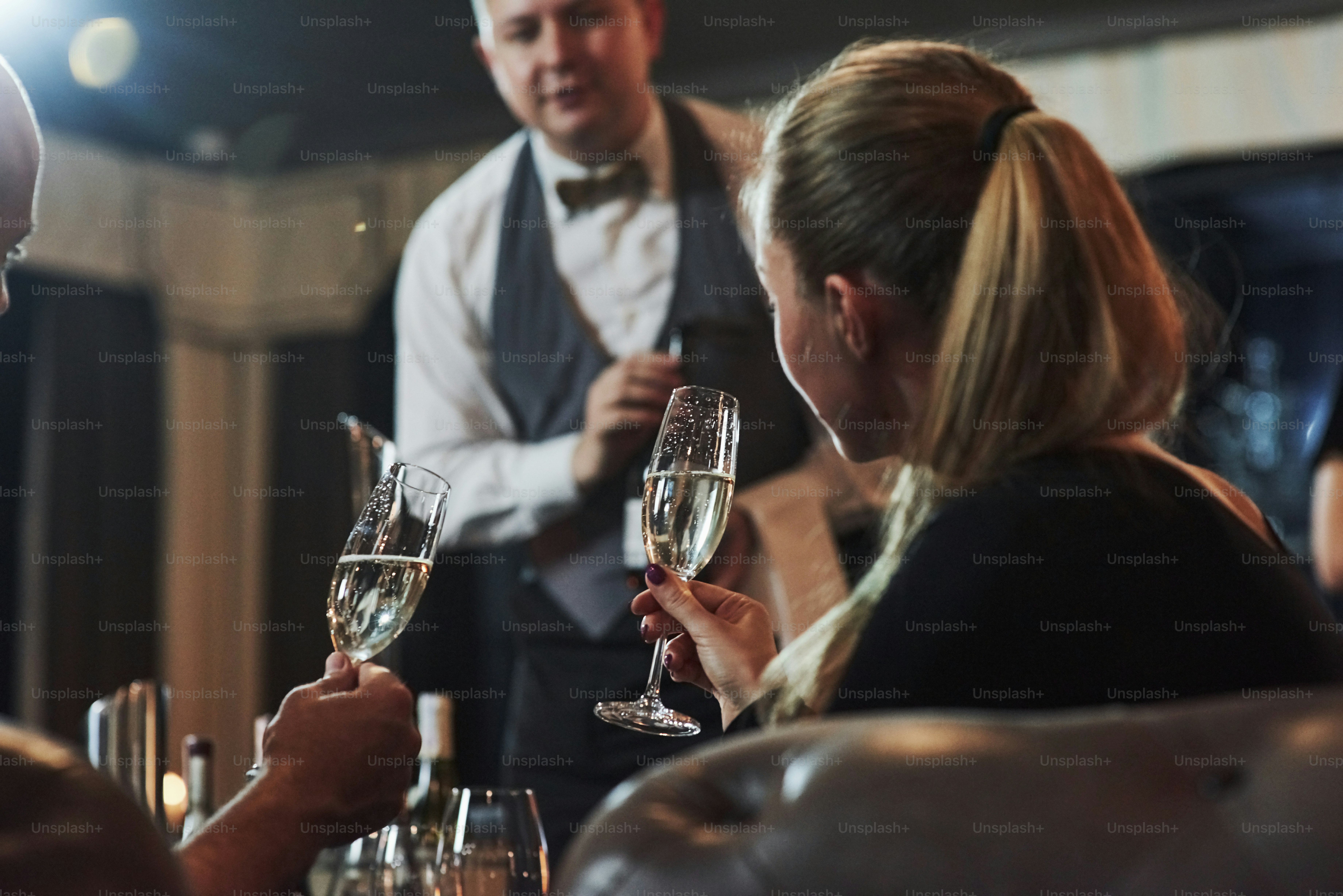 Making an order. Girl with her boyfriend have nice evening at beautiful ...