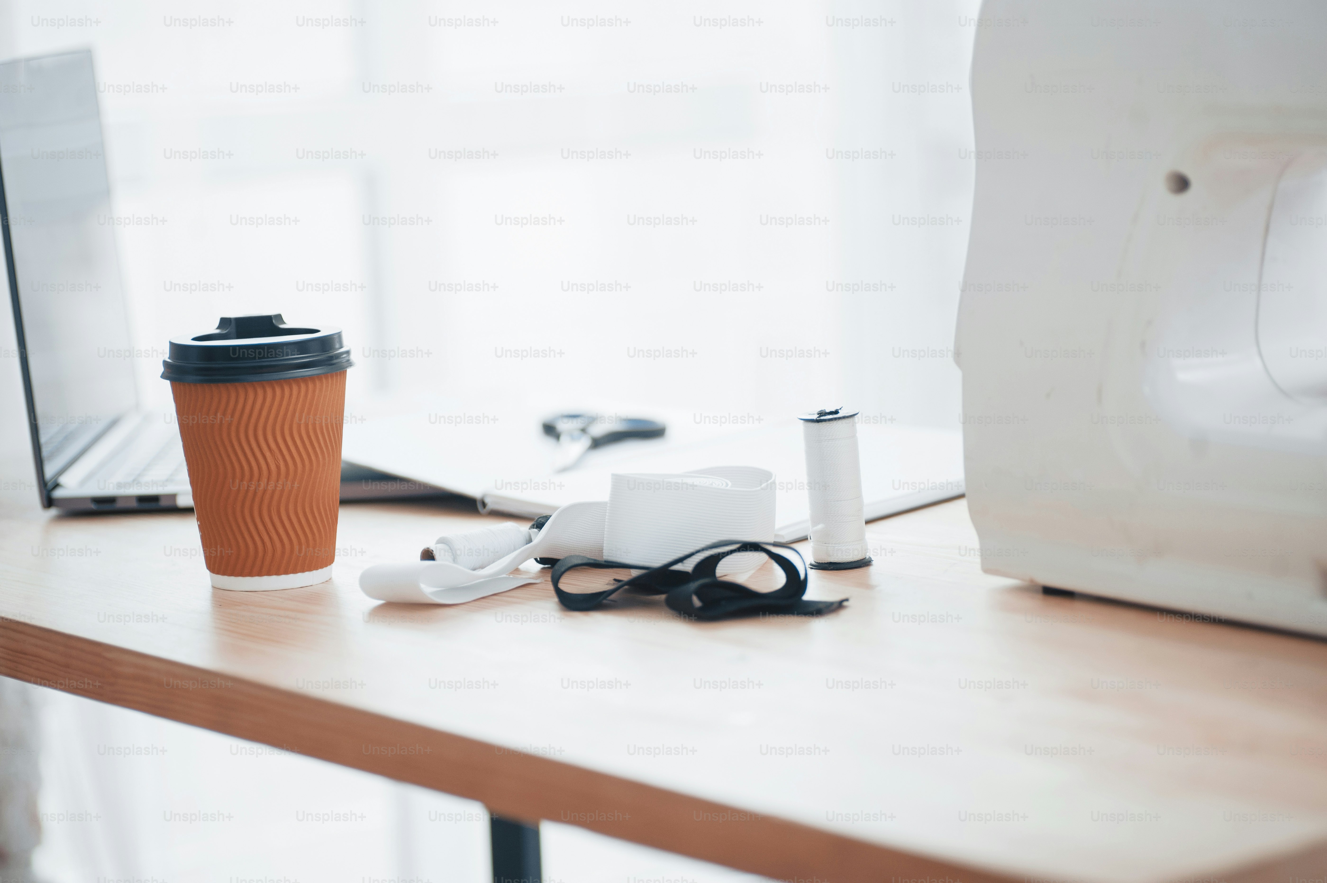 Close up photo of workspace with table and tools for sewing clothes on ...