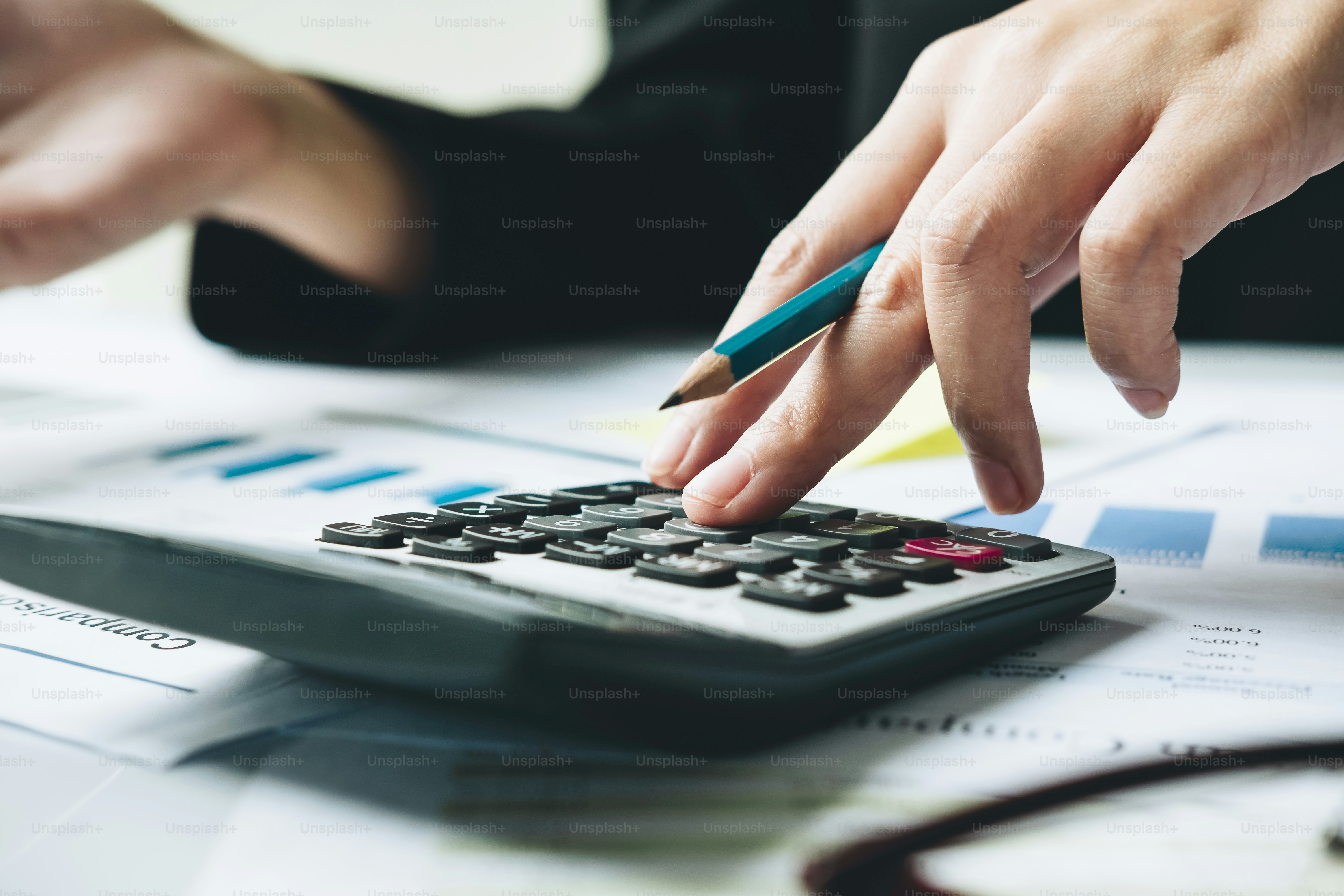 Close up hand of bookkeeper or financial inspector hands making report ...