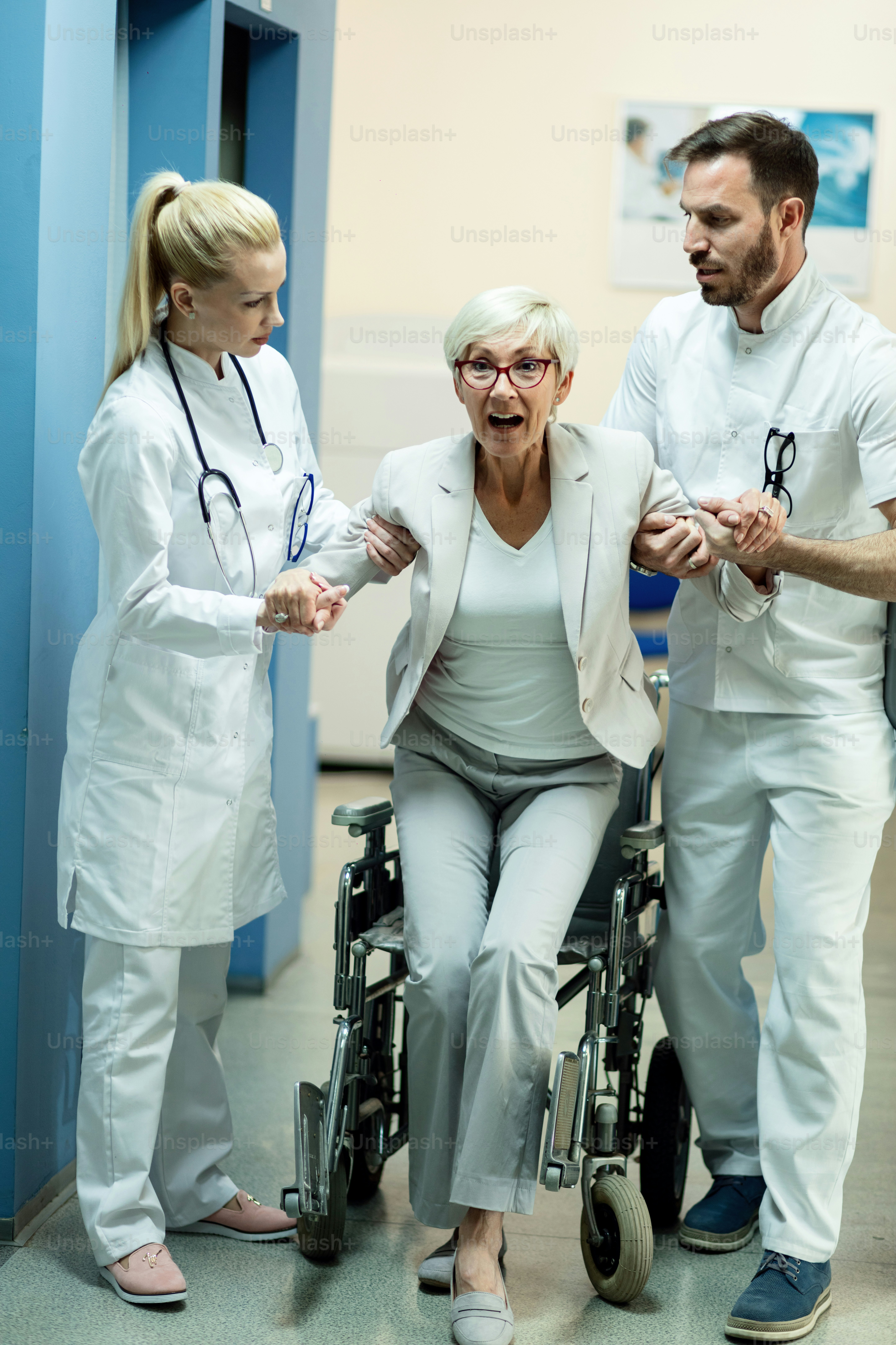 Disabled female patient looking surprised while getting up form the ...