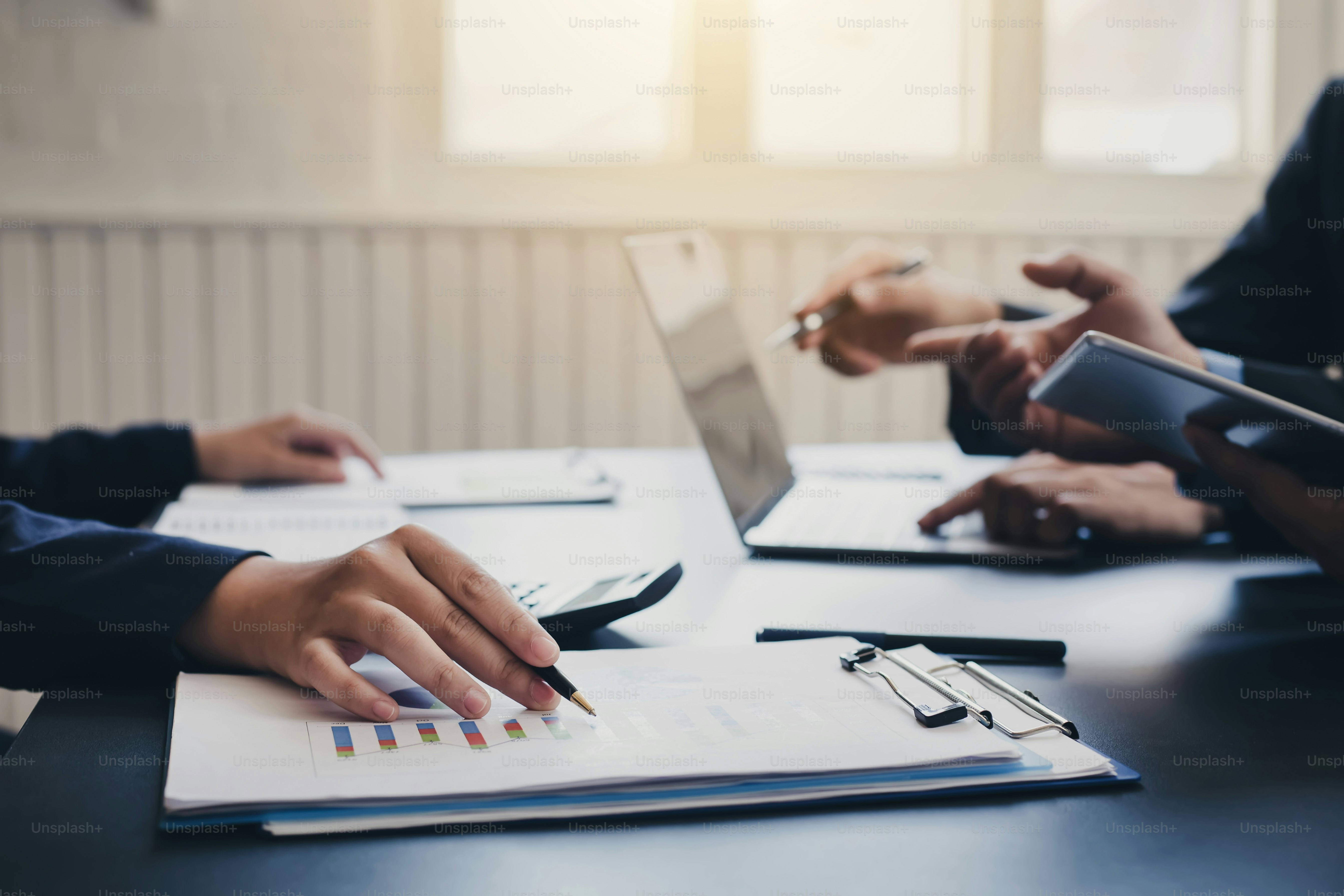 Business people meeting together about investment and the discussion ...