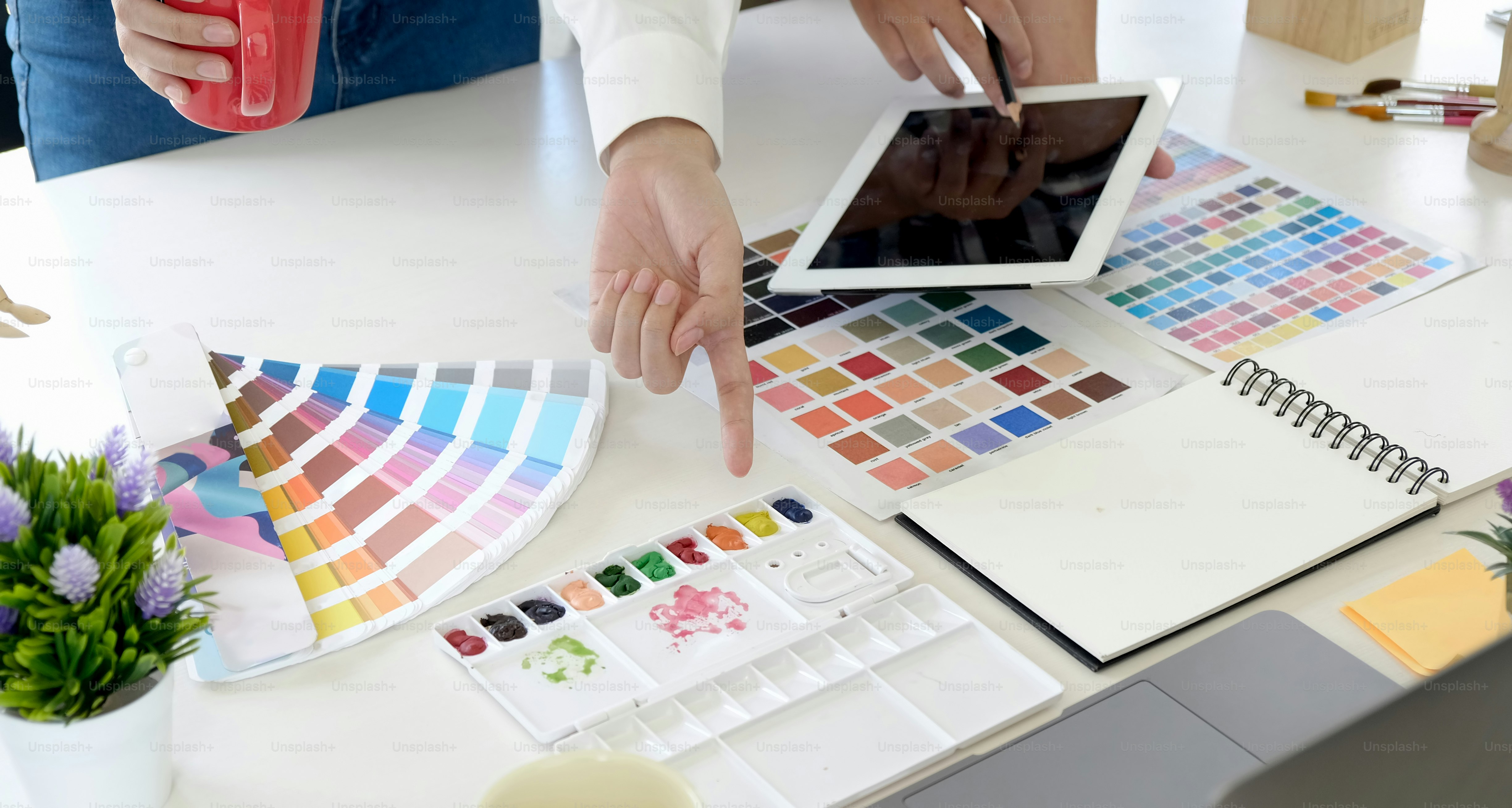 Designers team working paper graphic with color chart and tablet photo ...