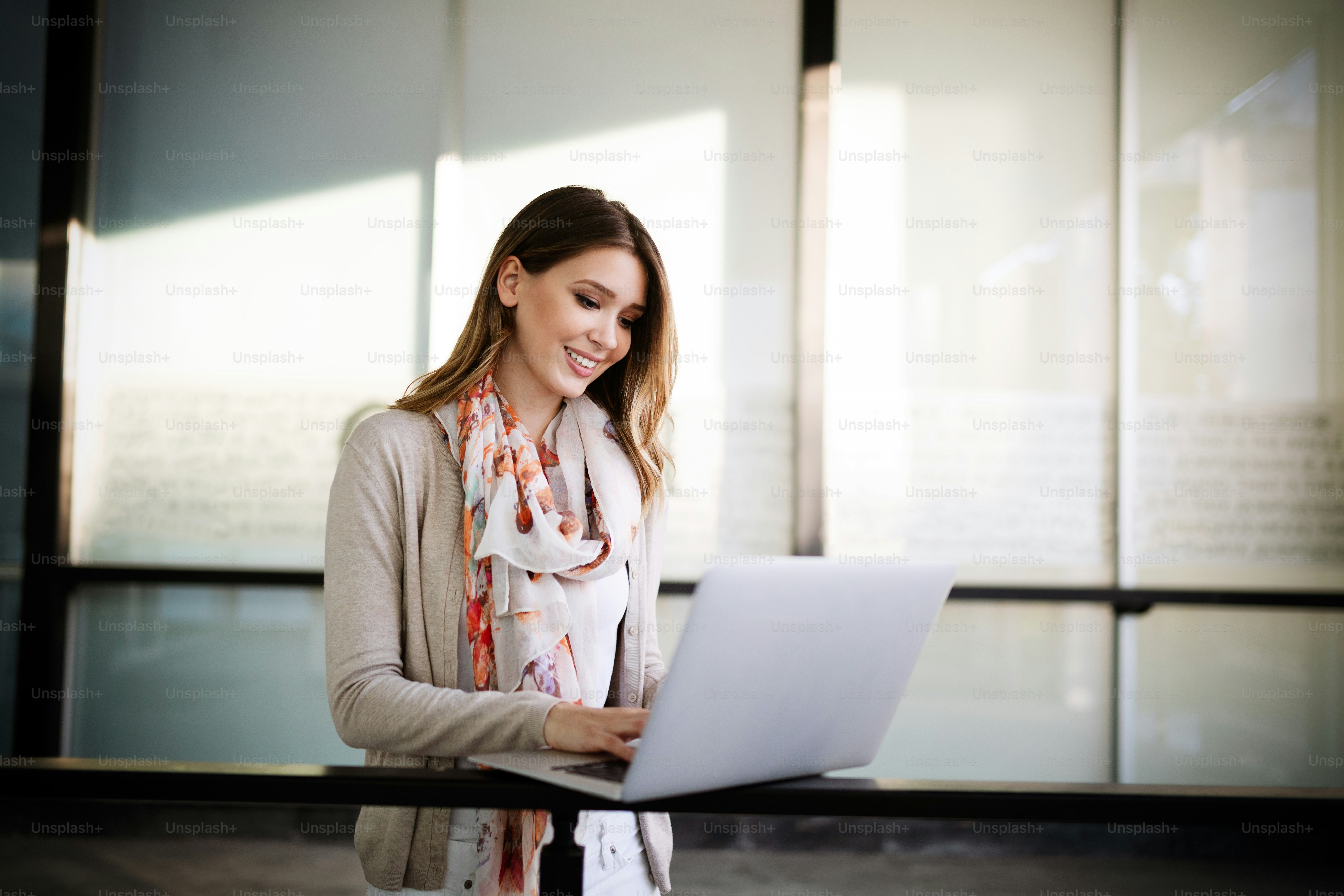 Happy smiling girl working online or studying and learning while using ...