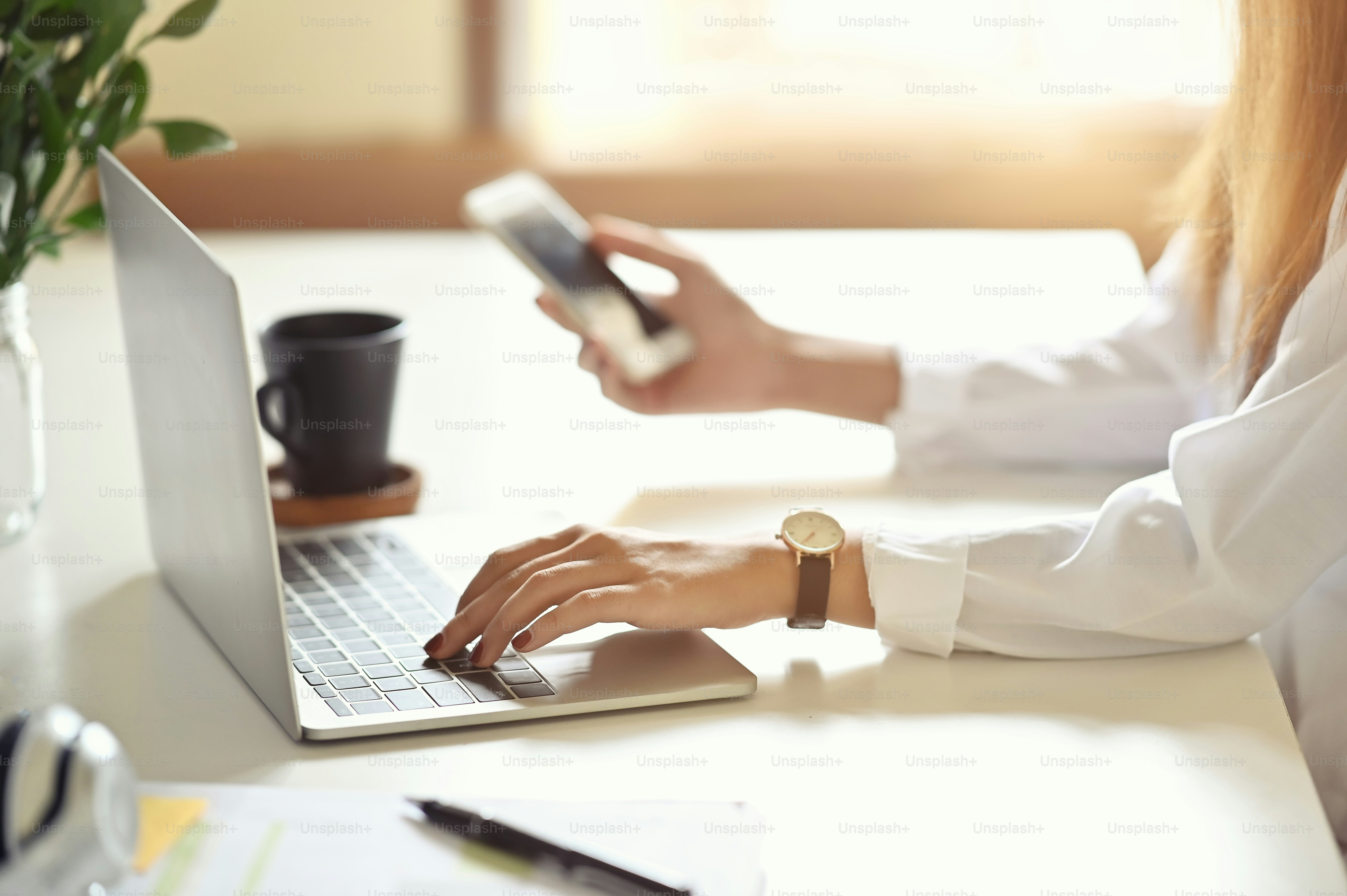 Women using laptop and smartphone on office desk. photo – Thailand ...