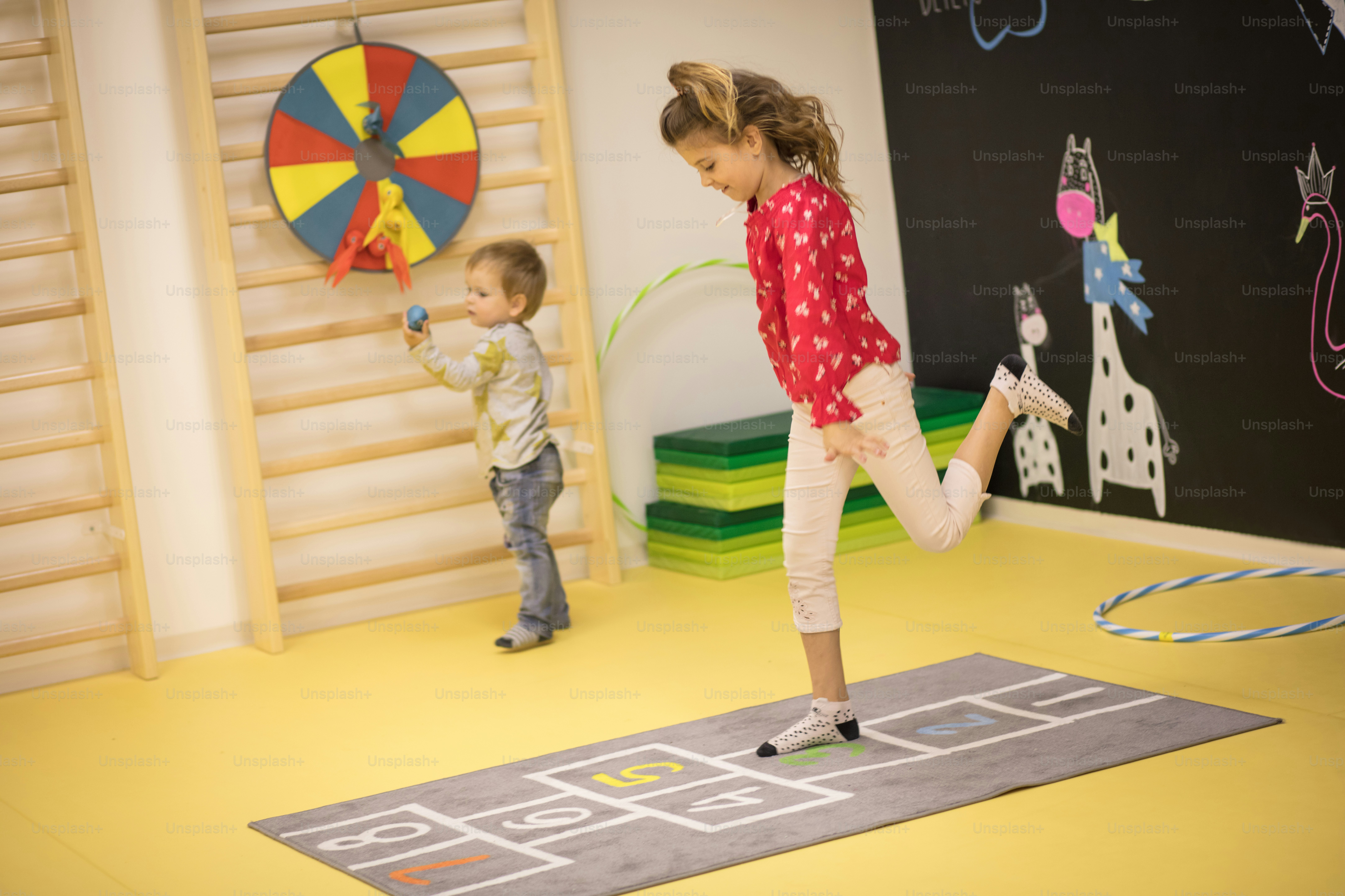 Lets jump. Children in preschool. photo – People Image on Unsplash