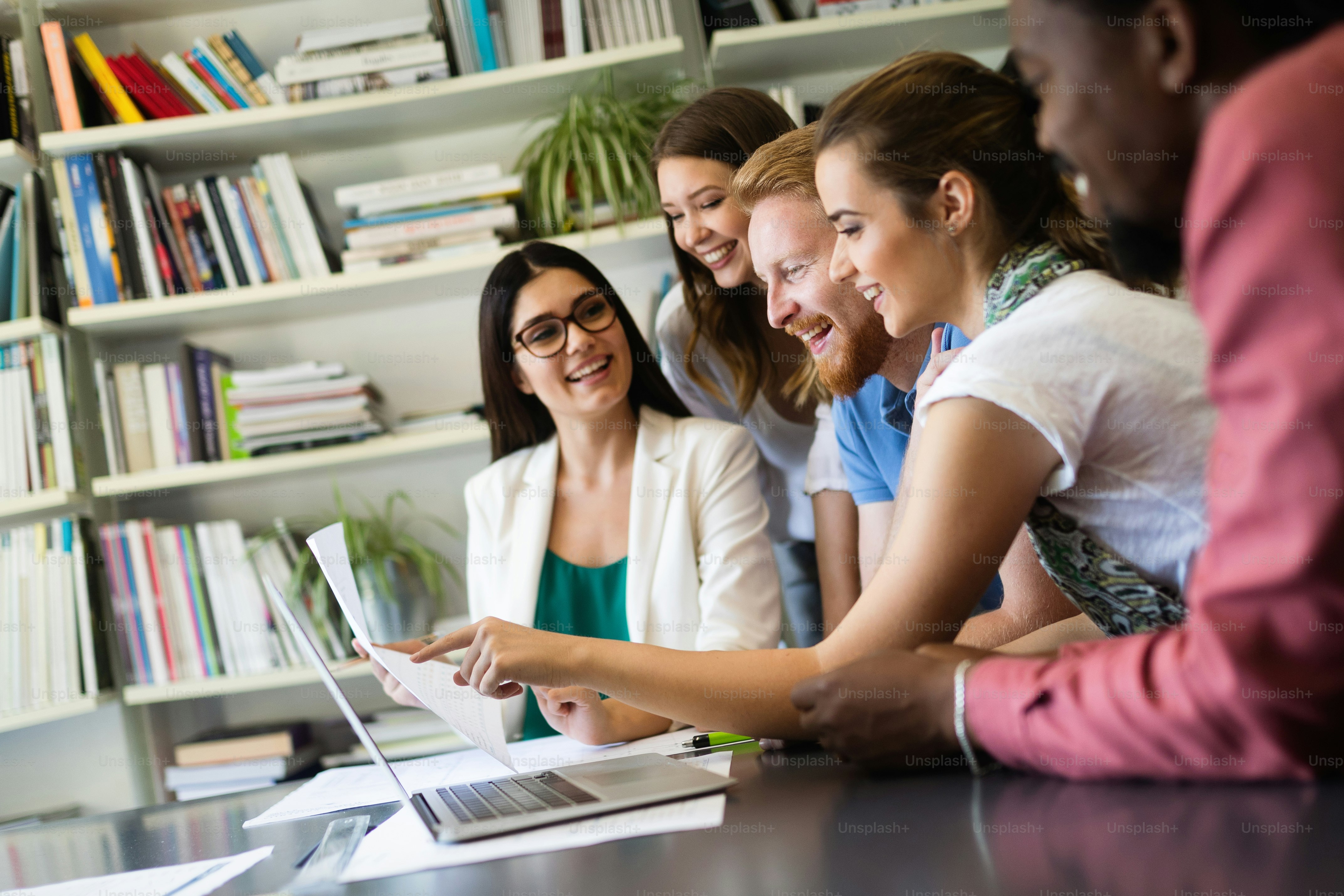 Successful group of business people at work in modern office photo ...