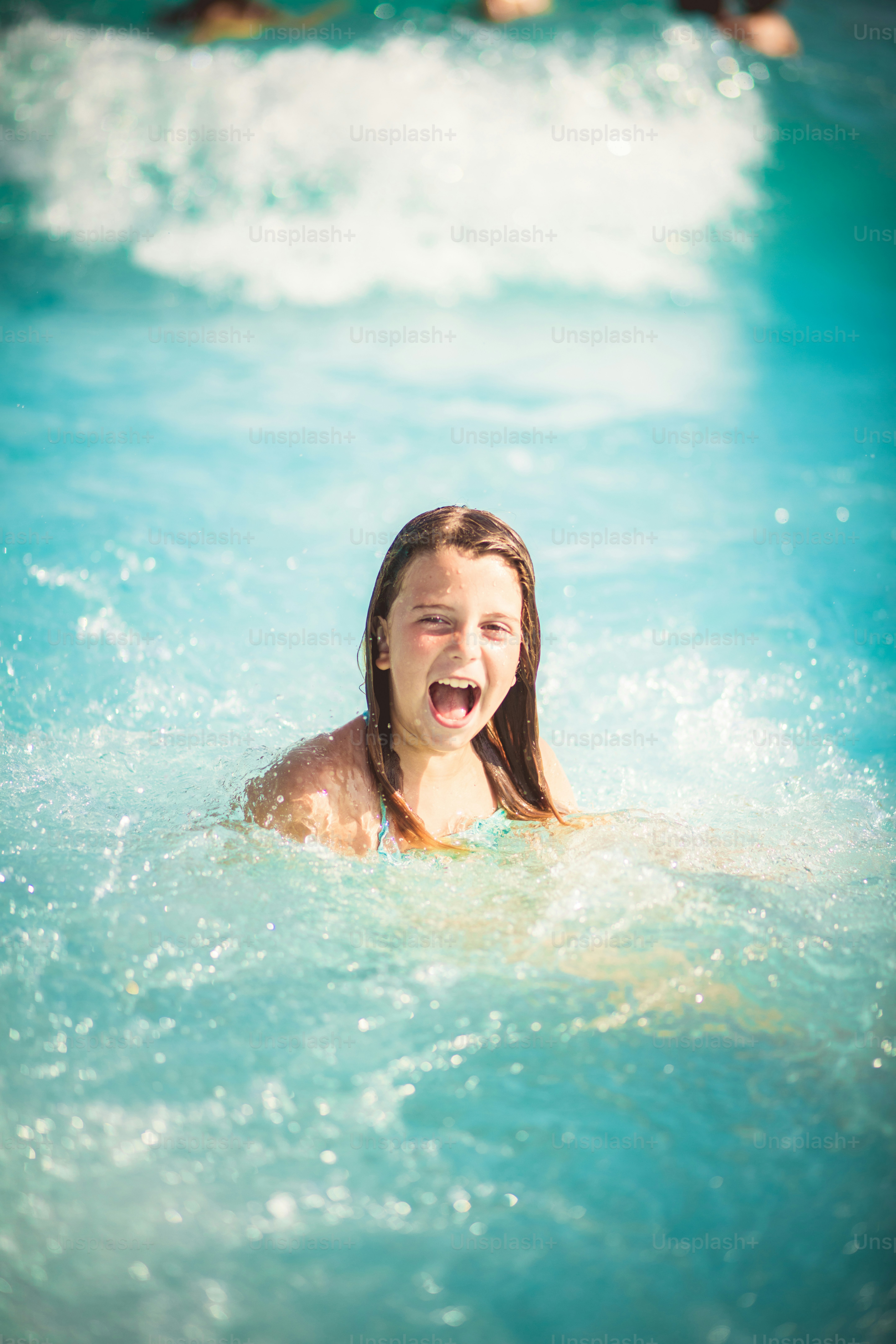 Upcoming adventure waves. Child swimming in the pool. photo – Serbia ...