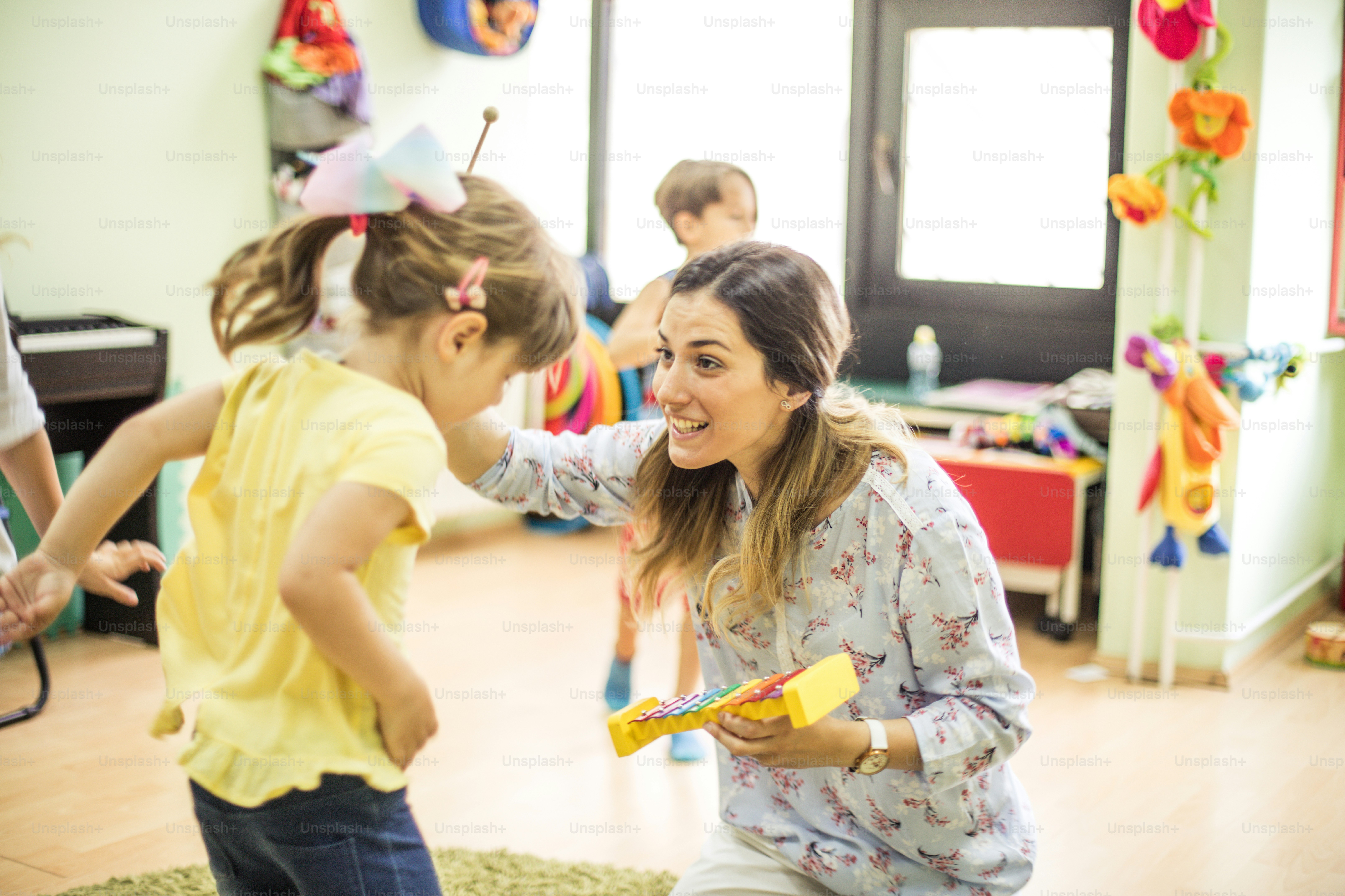 Miniature maestro. Child in music school with teacher. photo – Piano ...