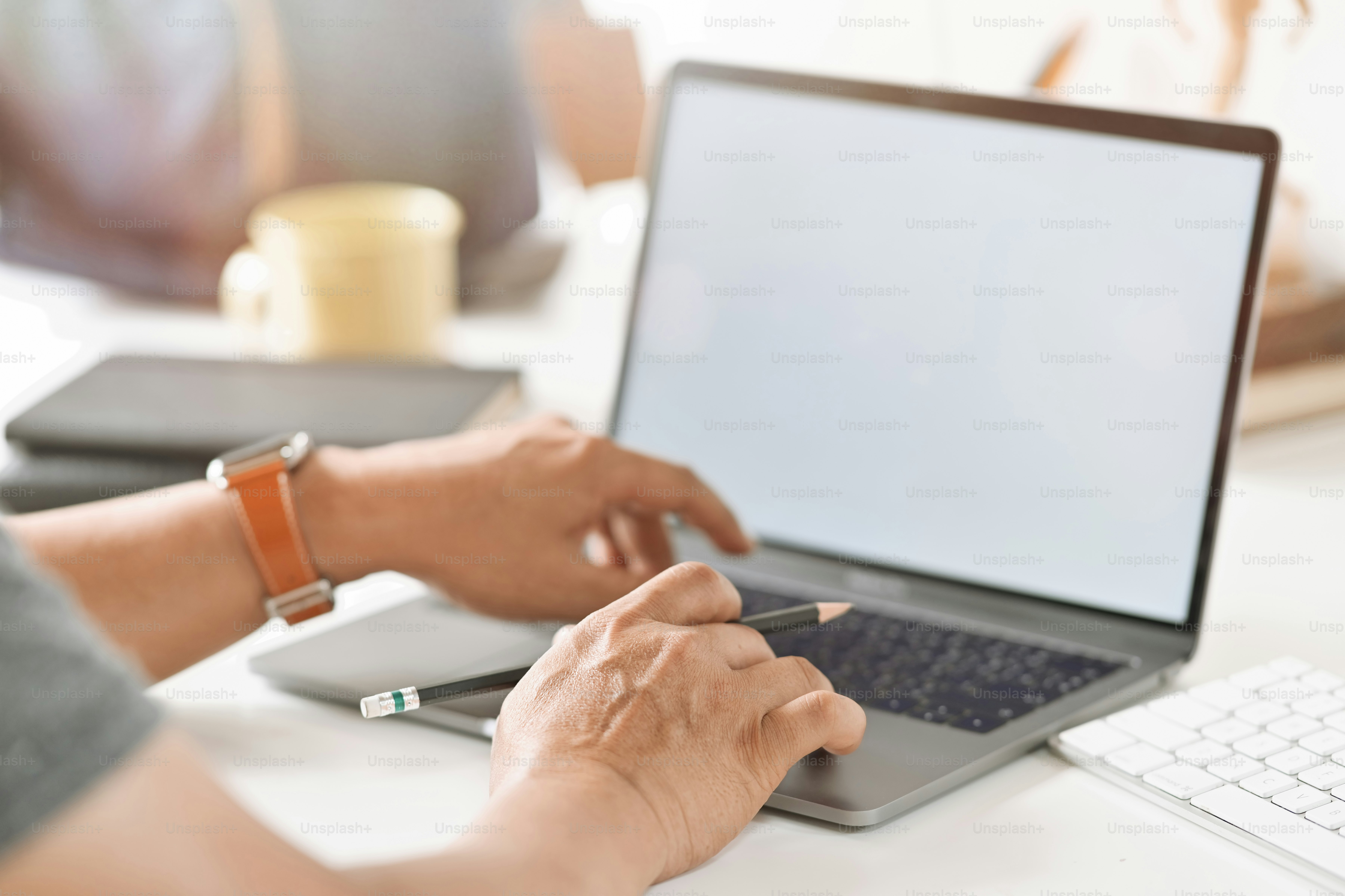 Cropped shot businessman hand working with his laptop on desk workspace ...