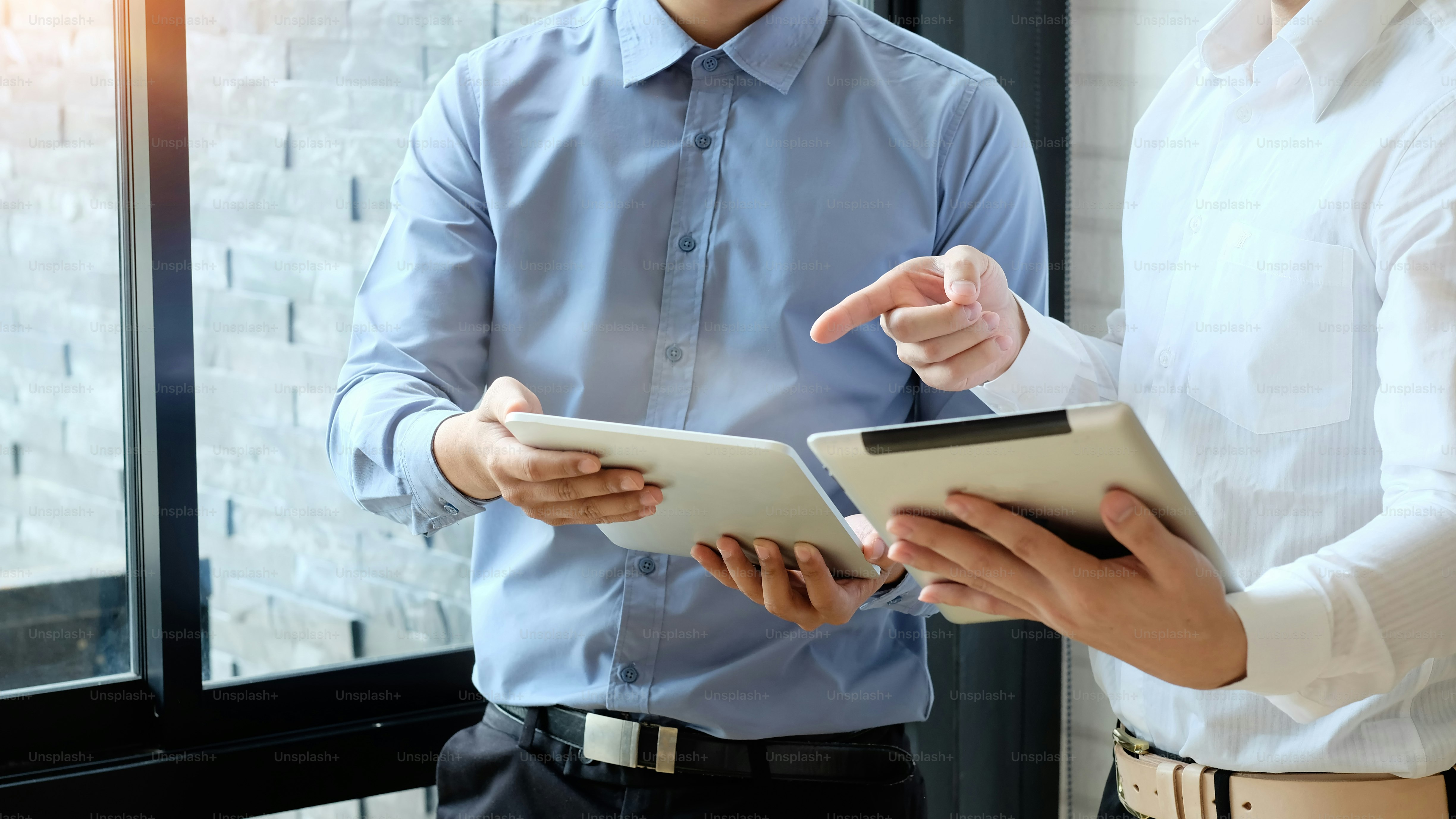 Cropped shot business together consult with digital tablet and computer ...