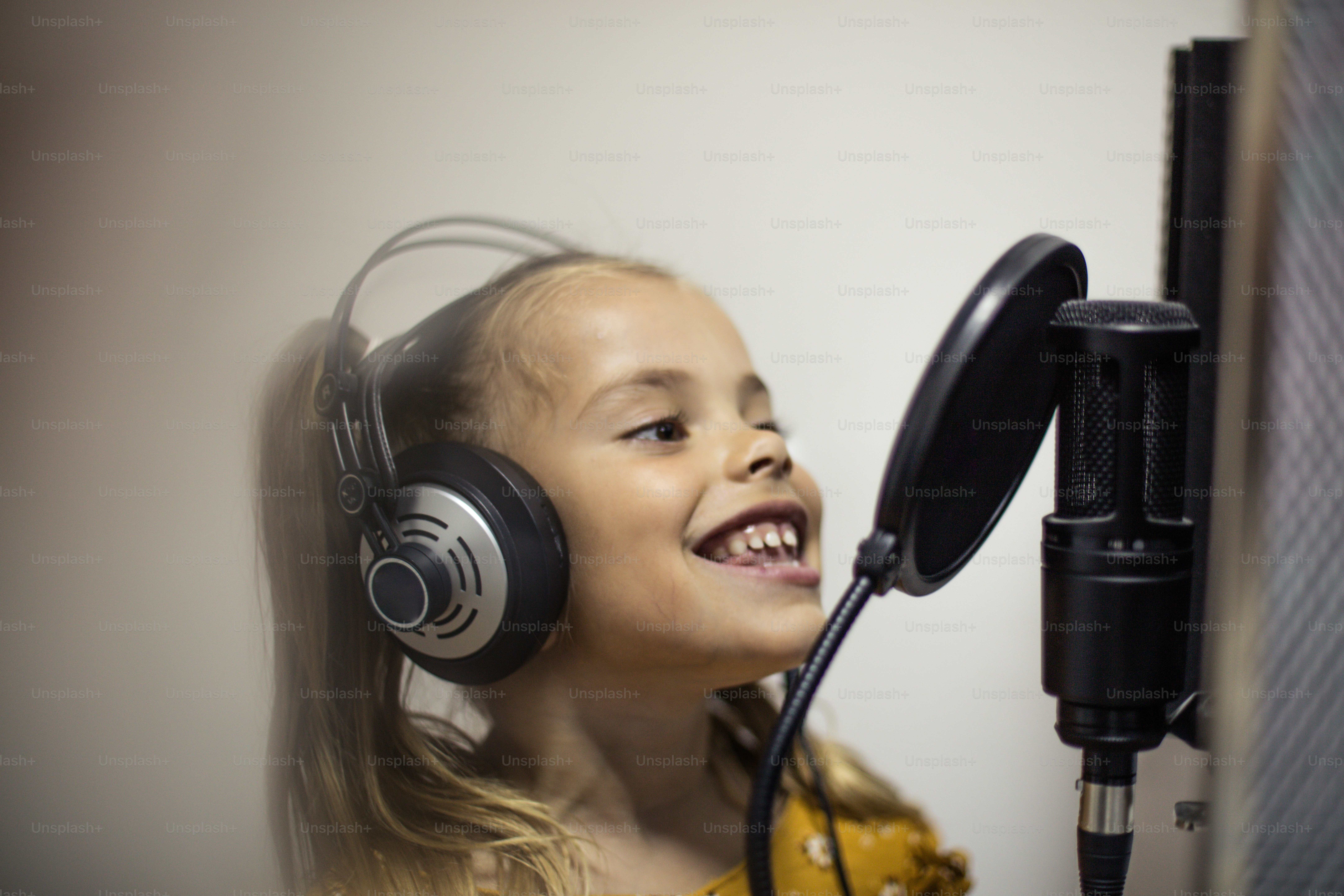 As a real music star. Child in musical school. photo – Headphones Image ...