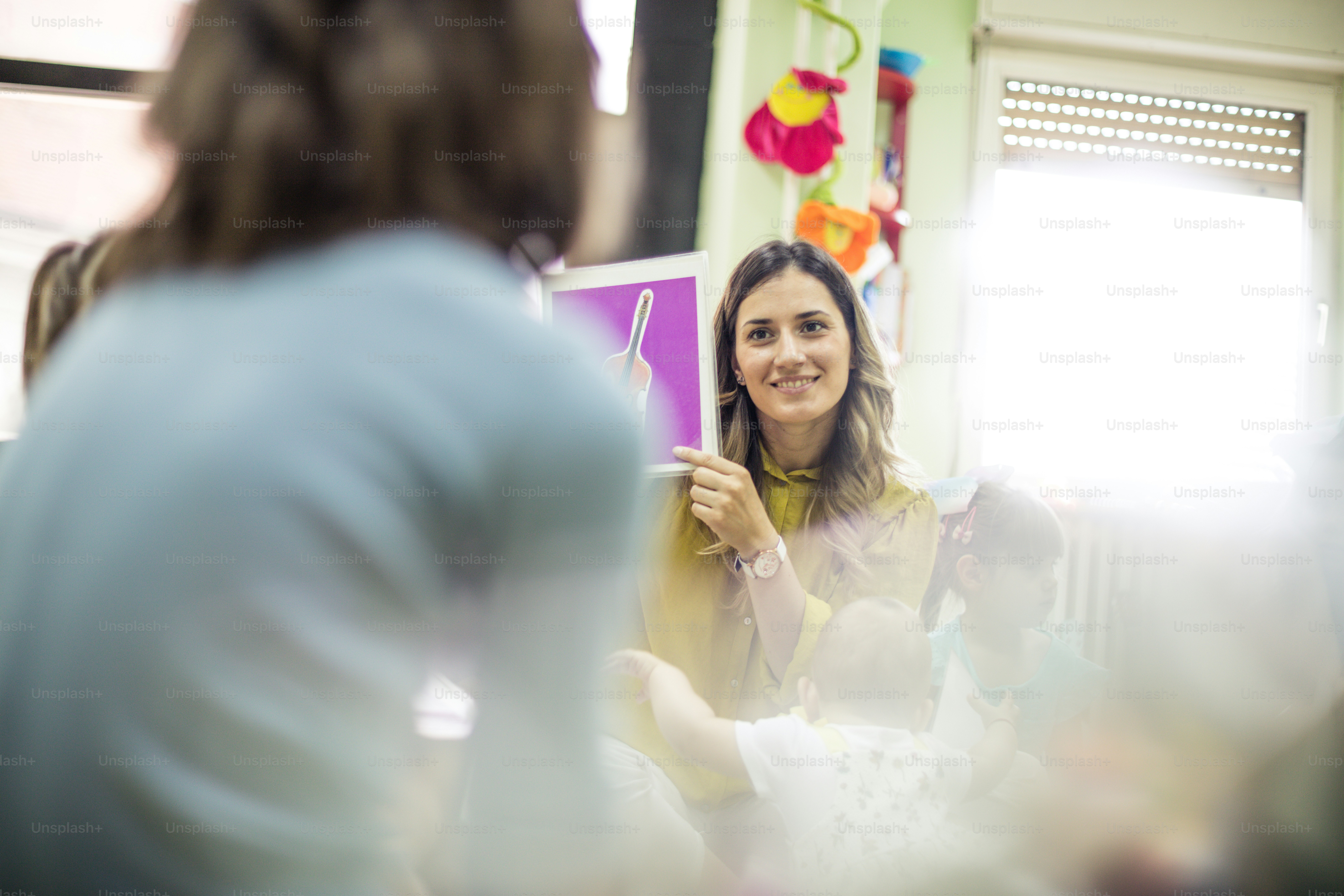 Miniature maestro. Child in music school with teacher. photo – Piano ...