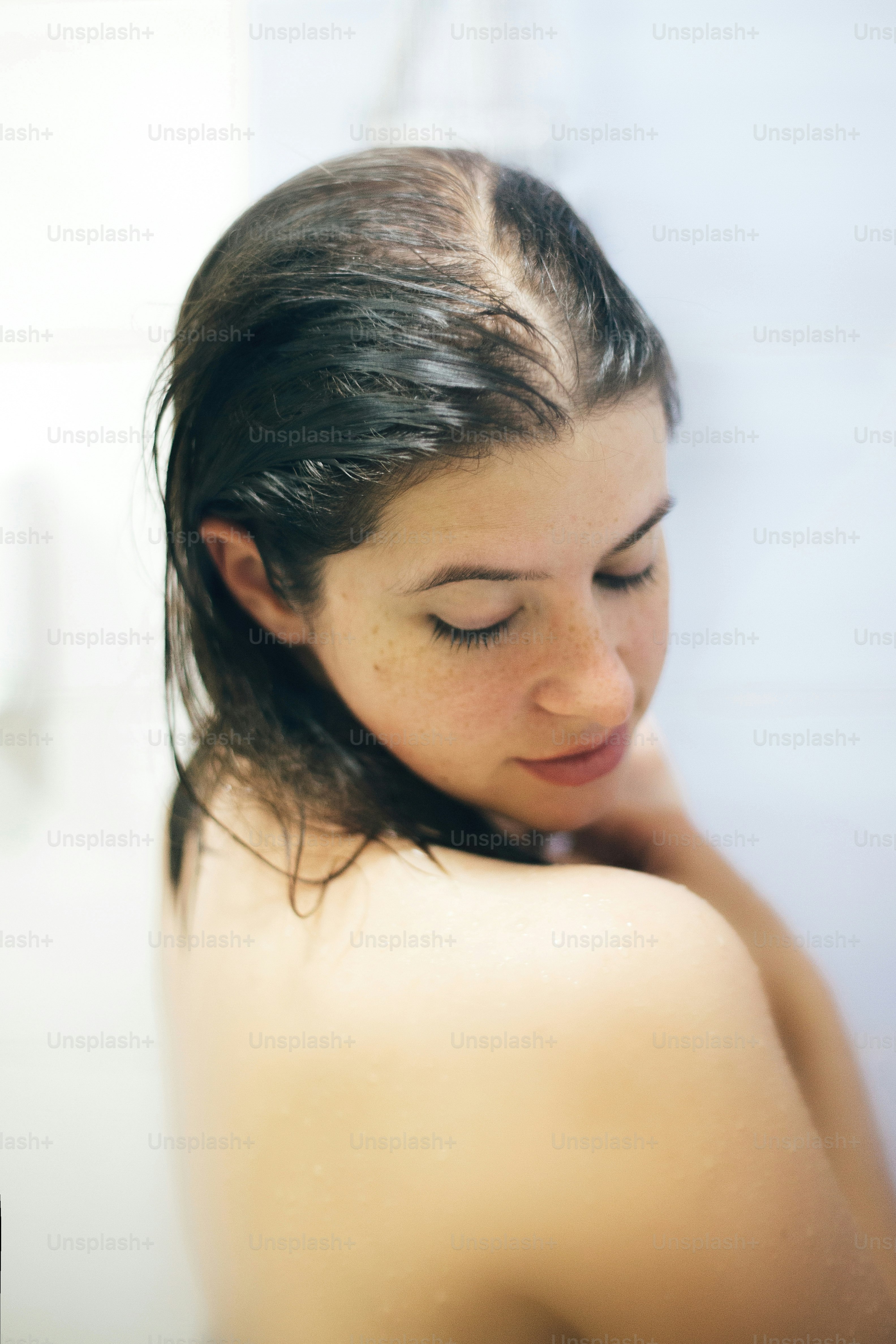 Young Happy Woman Taking Hot Shower At Home Or Hotel Bathroom