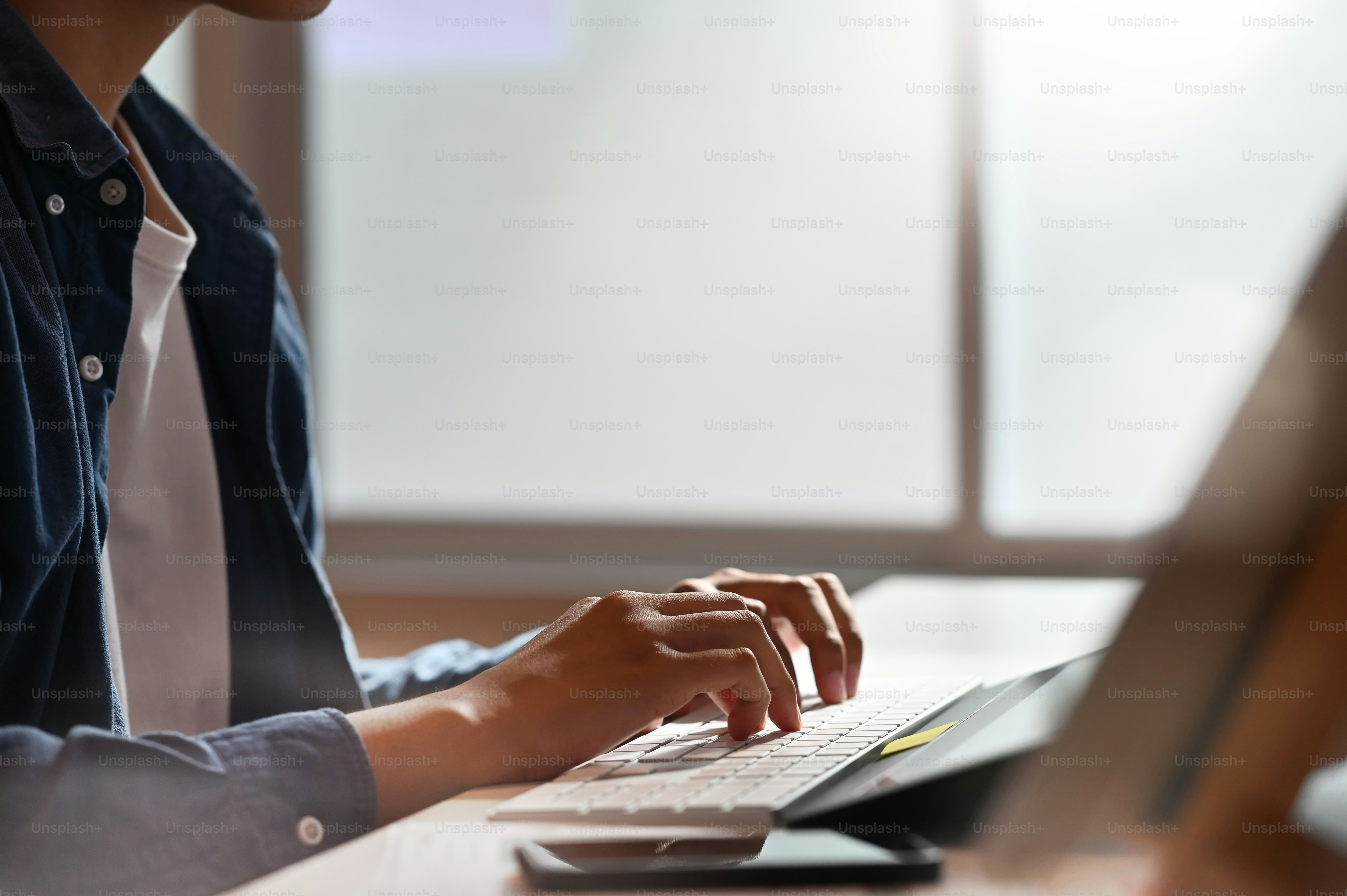 Cropped shot man using computer with typing computer keyboard. photo ...