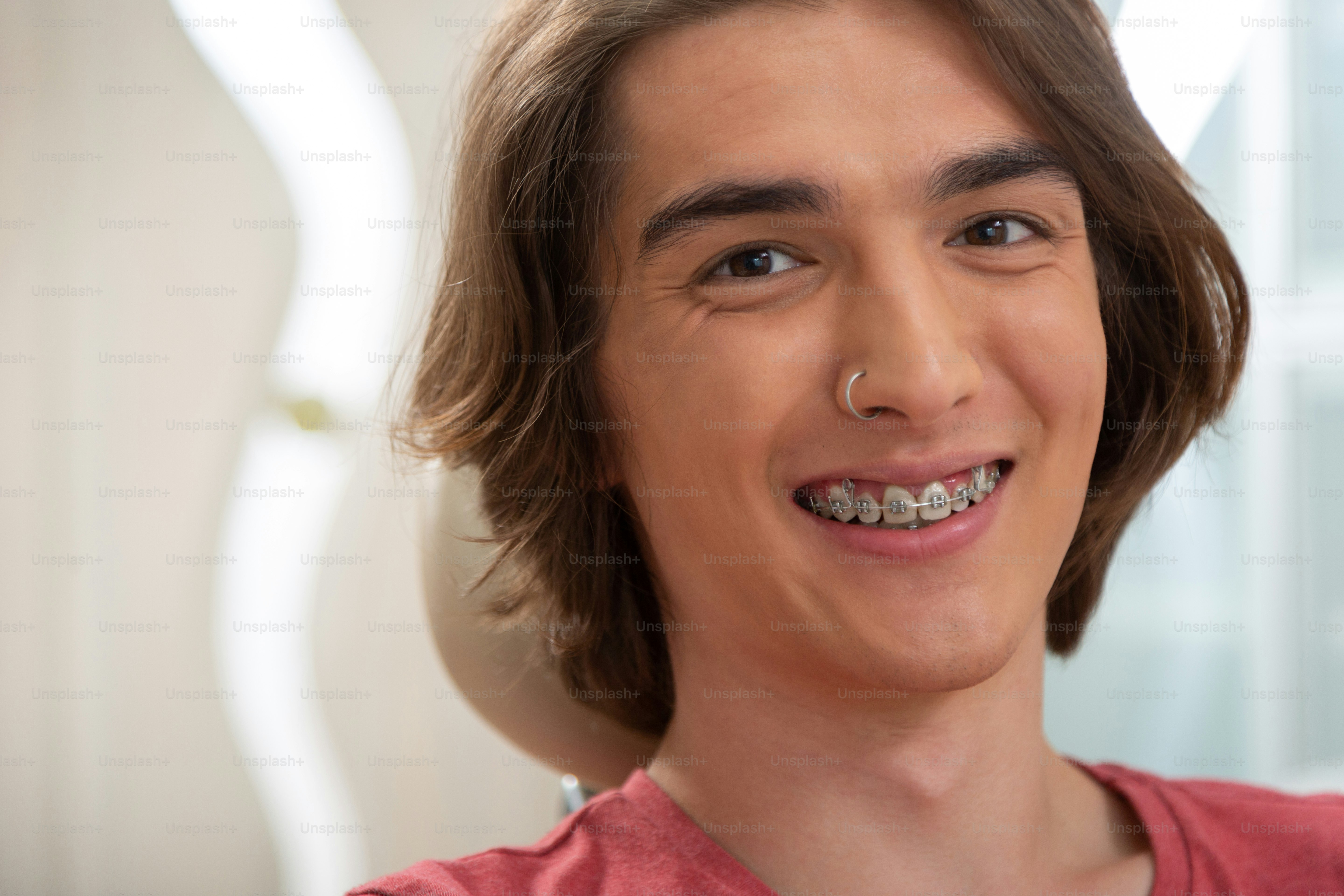 Toothy smile. Dark-haired young Caucasian male patient with dental ...