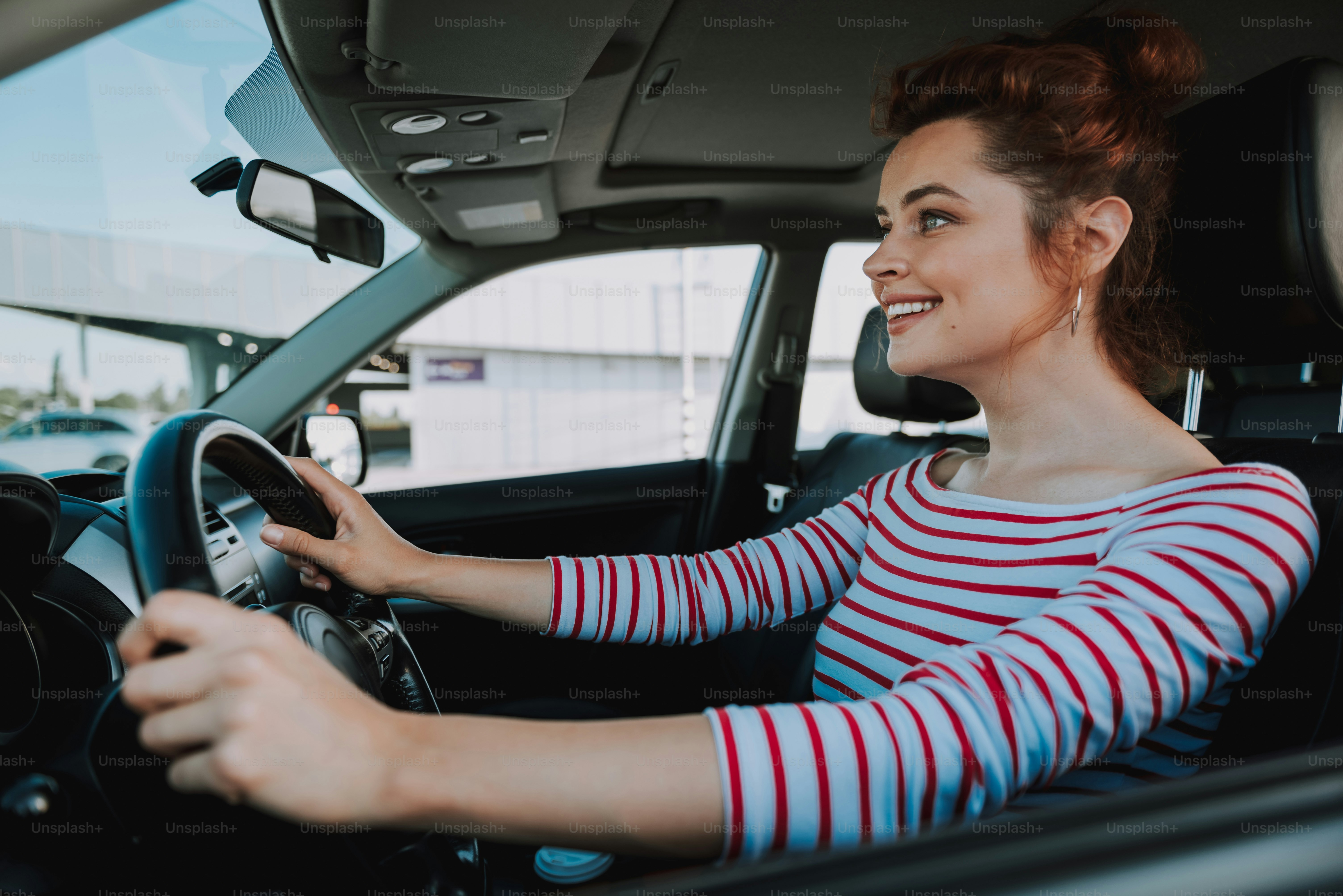 Side view portrait of charming lady in auto looking away and smiling ...