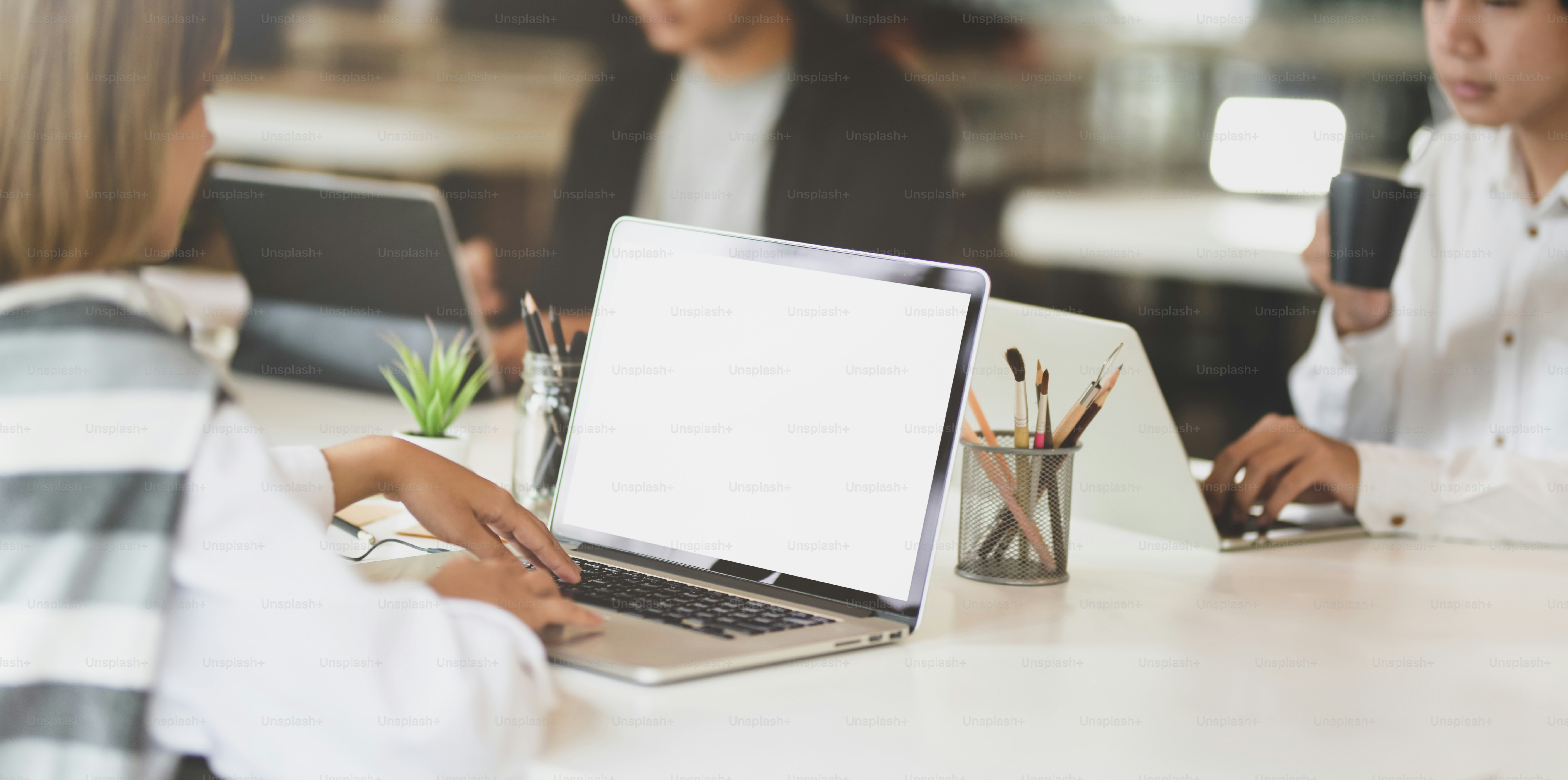 Young professional graphic designer team discussing the project ...