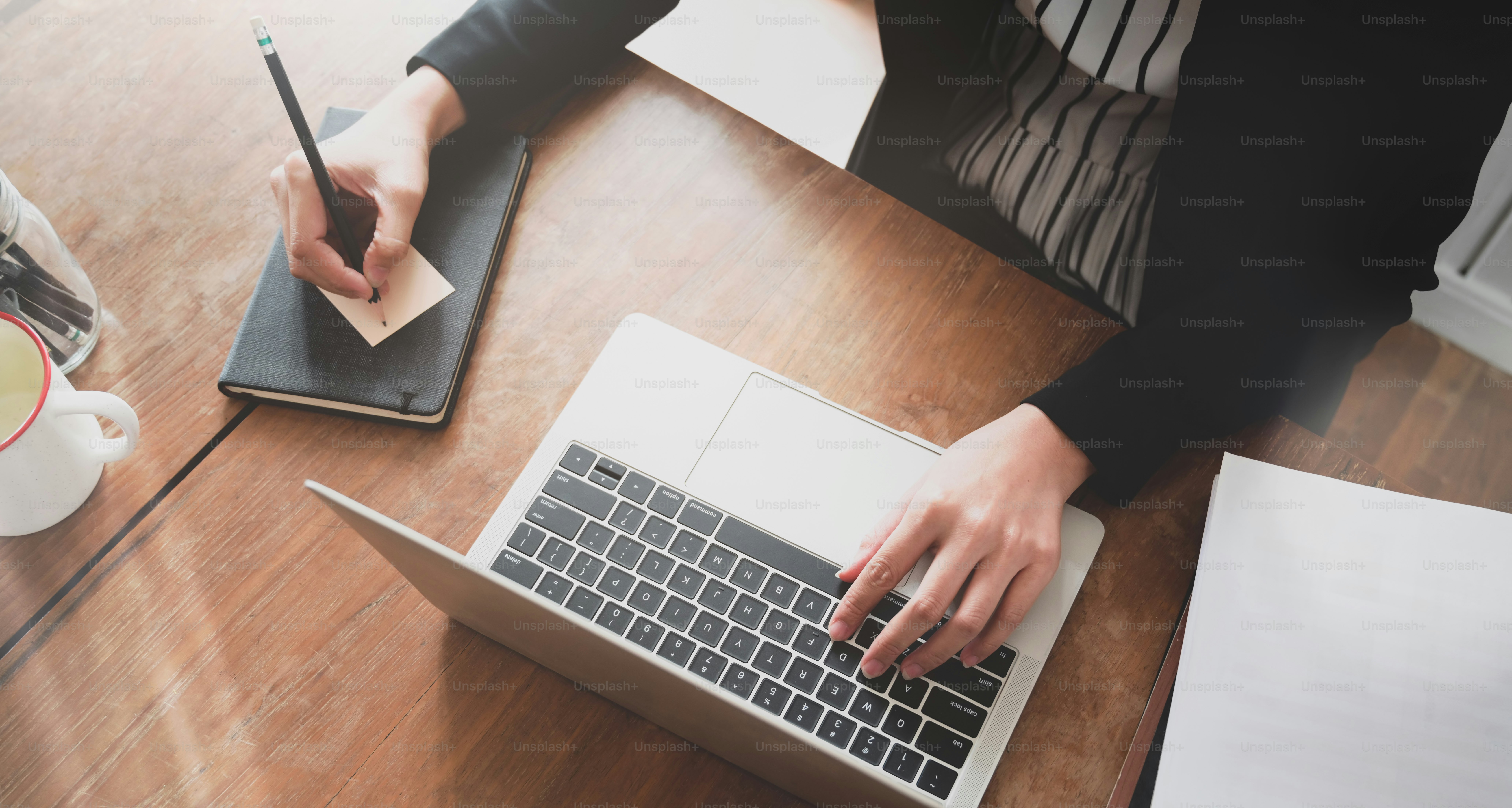 Top view of young designer editing her projects with stylus pen in ...