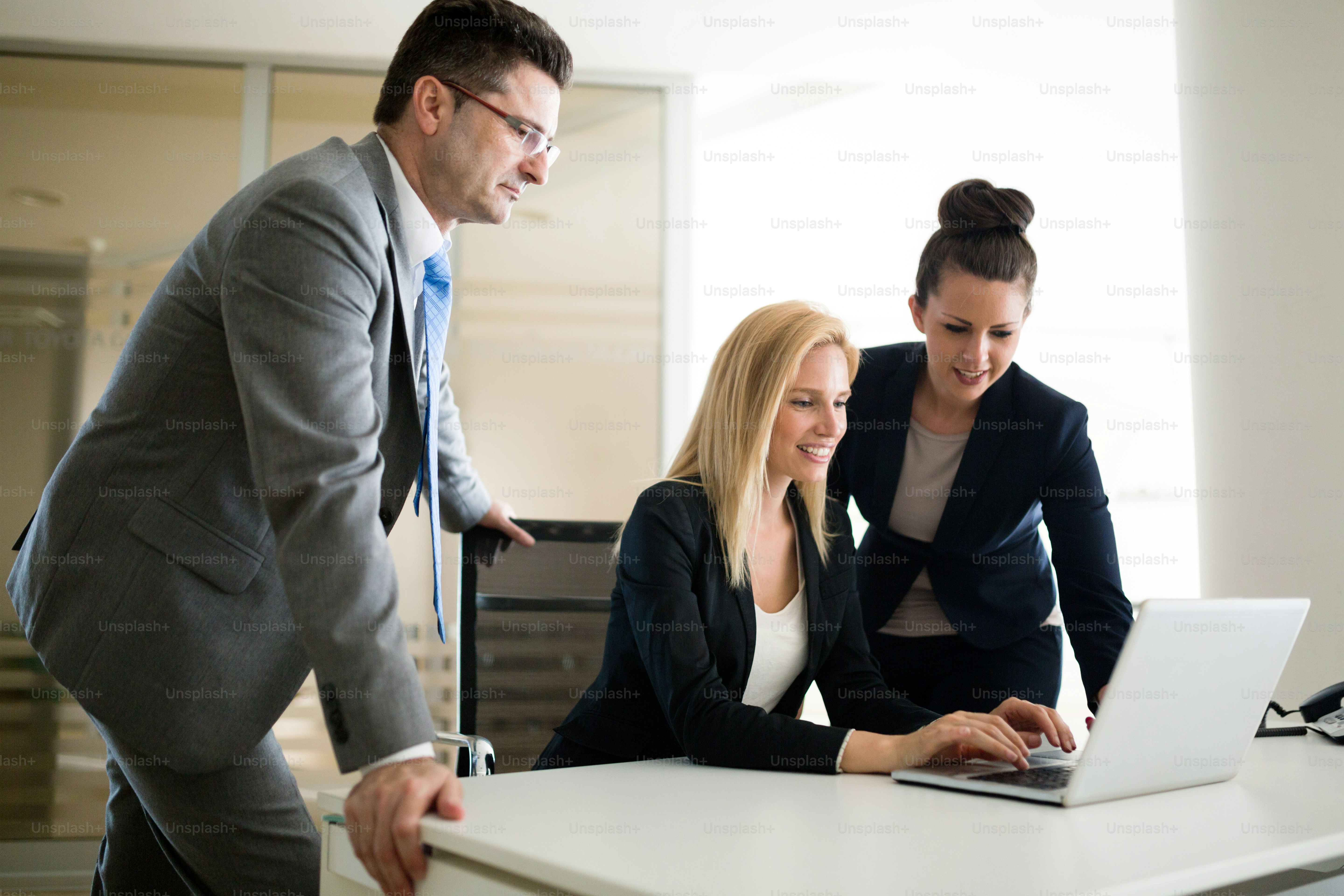 Picture of sales agents working together in company office photo ...