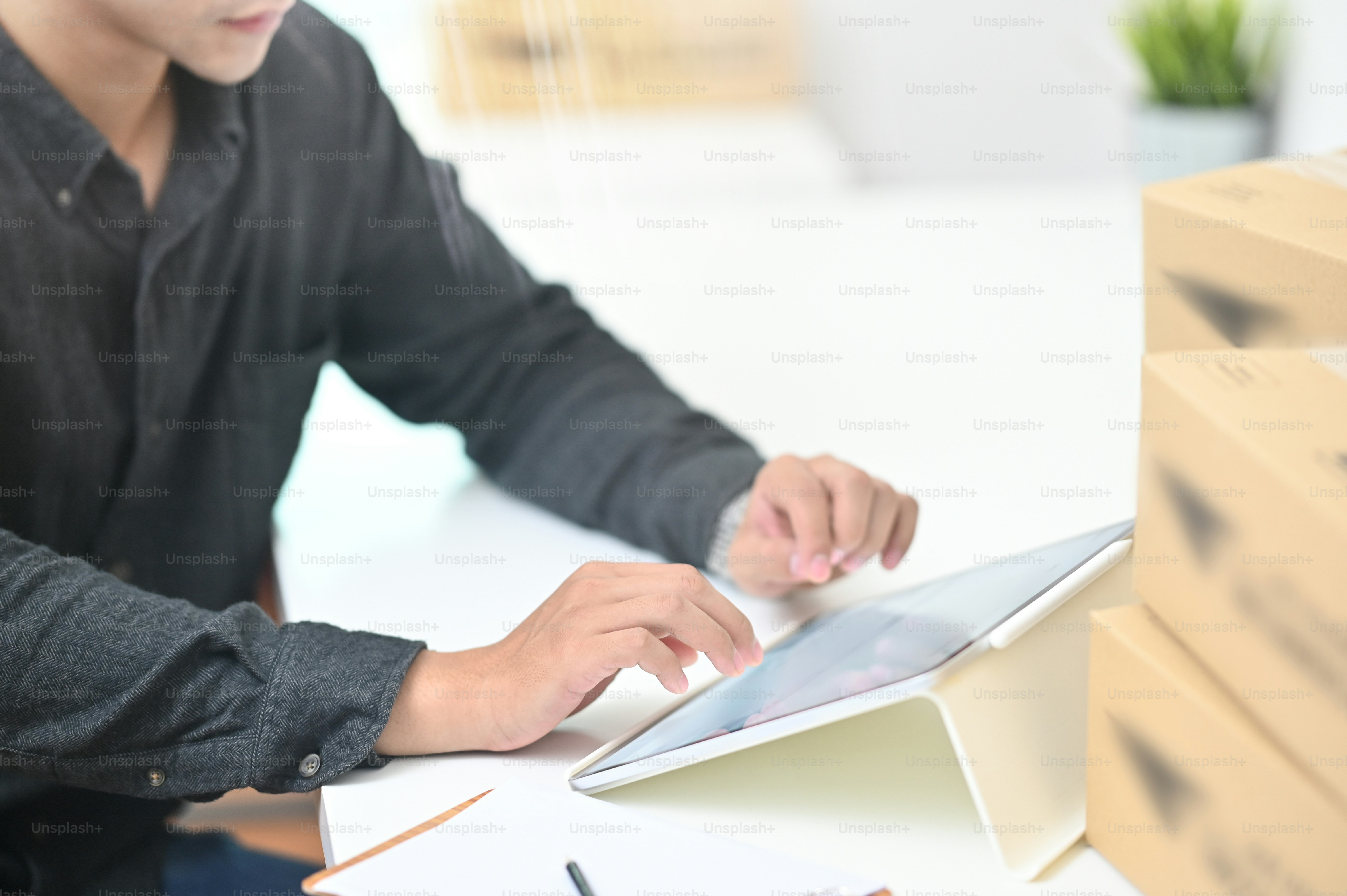 Sme business owner using digital tablet taking receive and checking ...