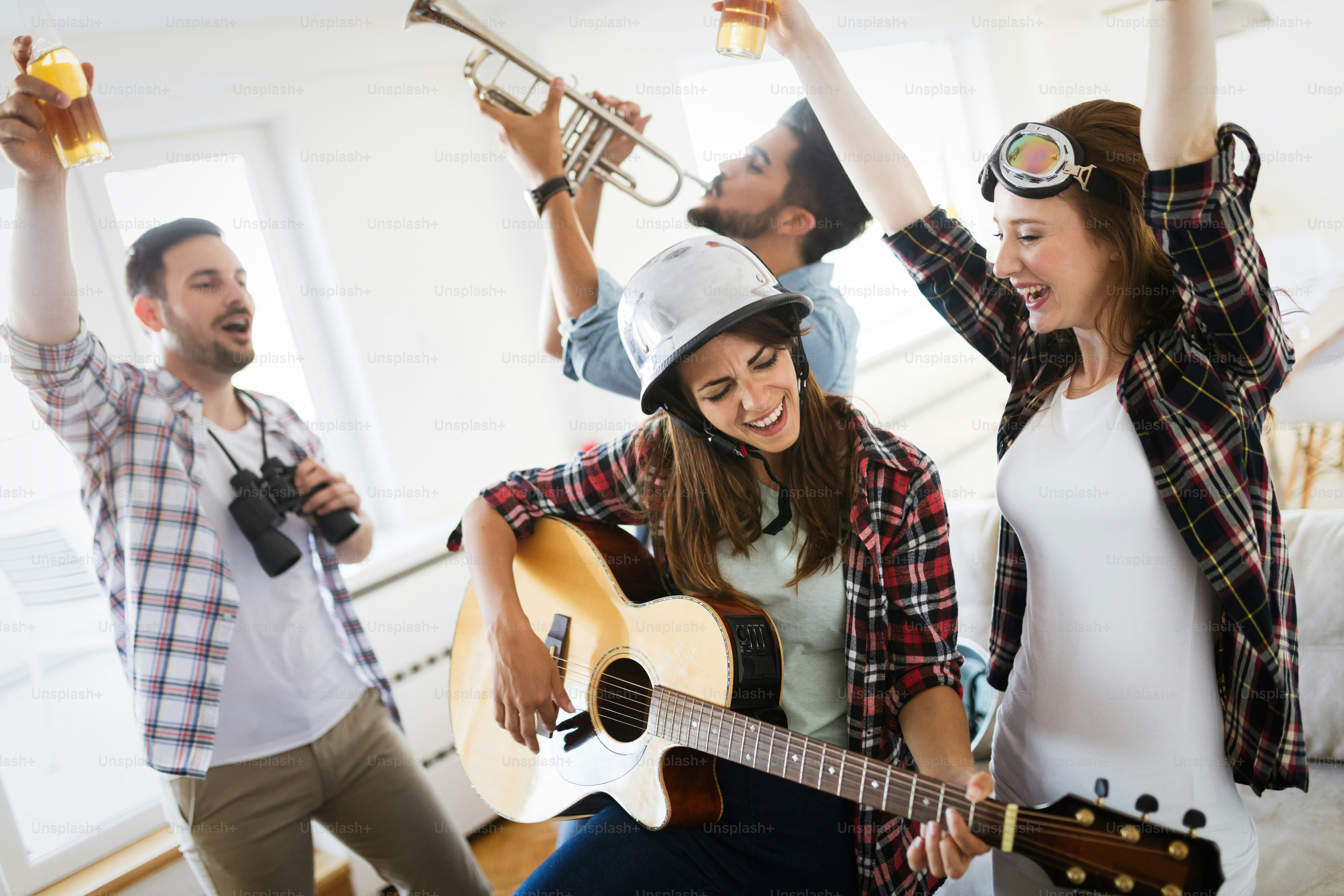Small group of young people hang out at the house party photo ...
