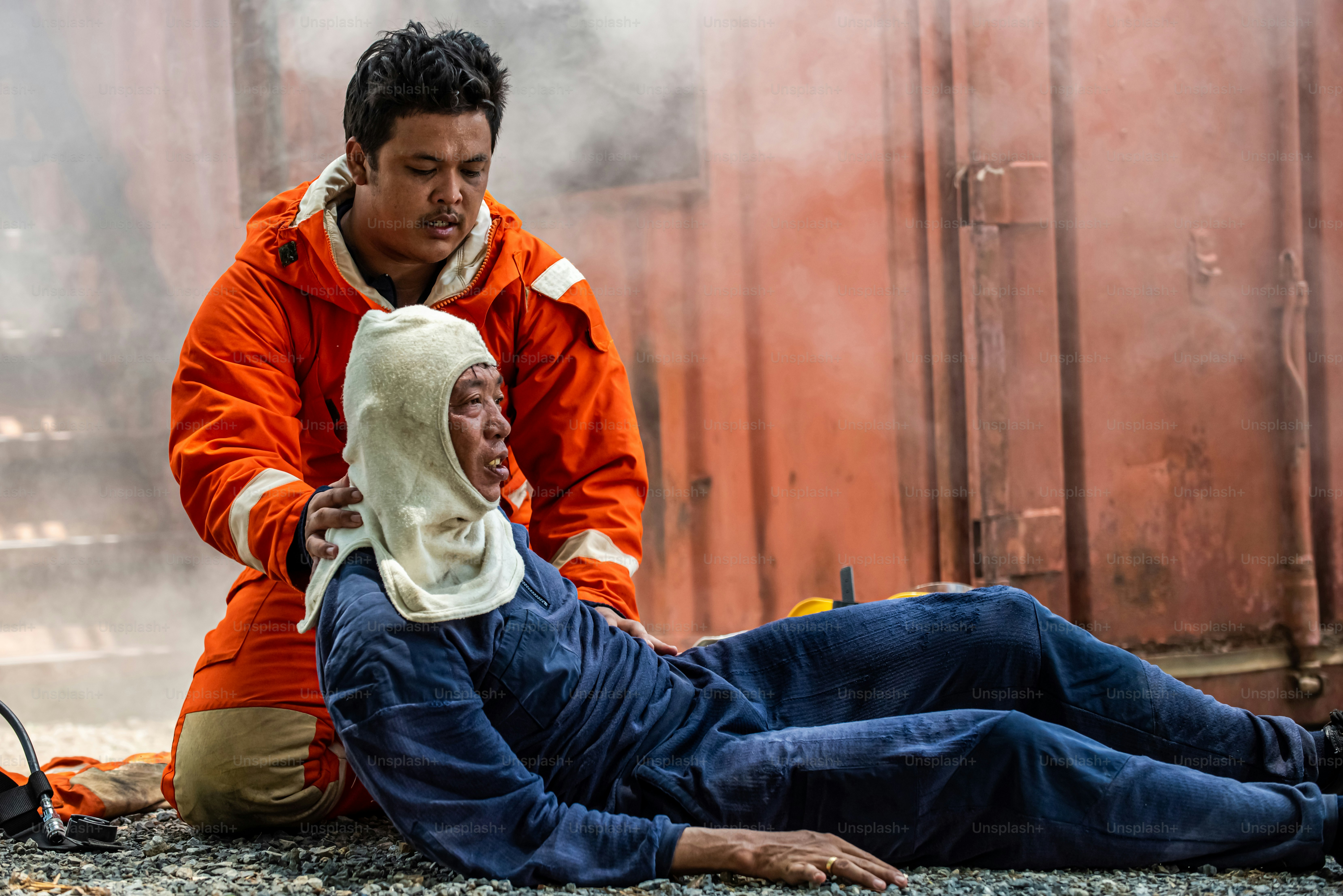 Medium shot of firefighter in fire suit on safety rescue duty help a ...