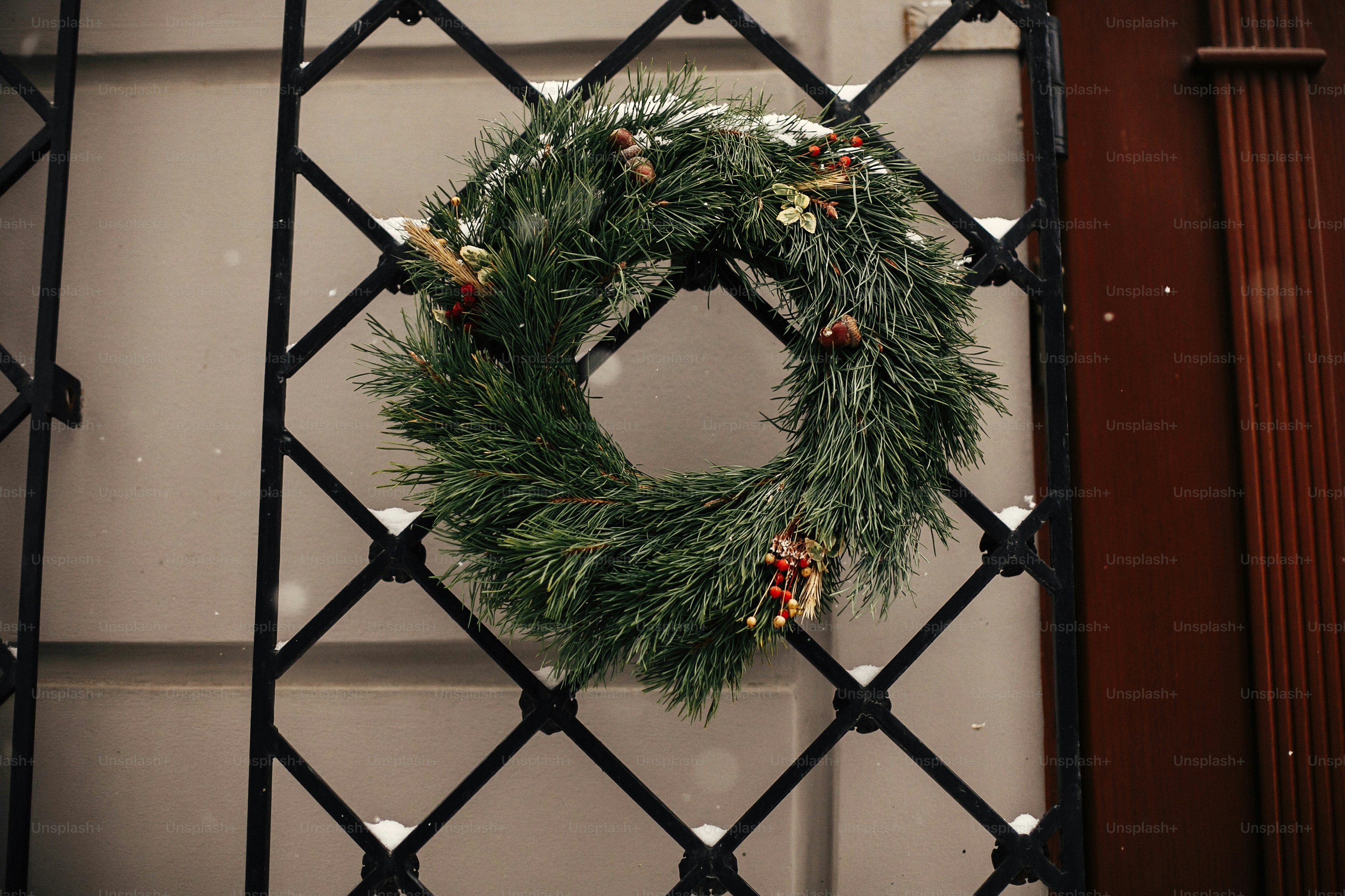 Christmas street decor. stylish christmas rustic wreath with pine cones ...