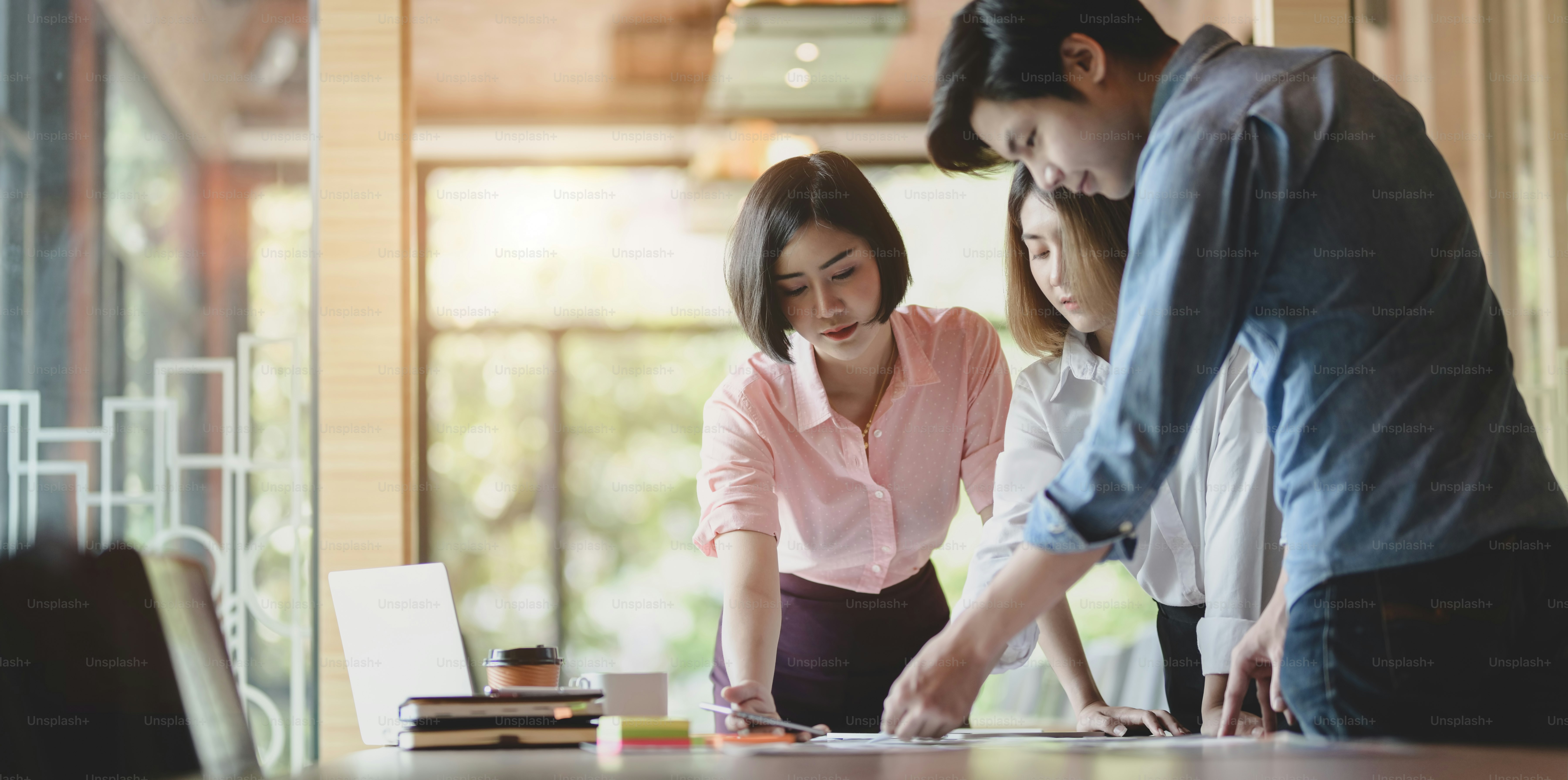 UX web developer team plaining the idea on smartphone application ...