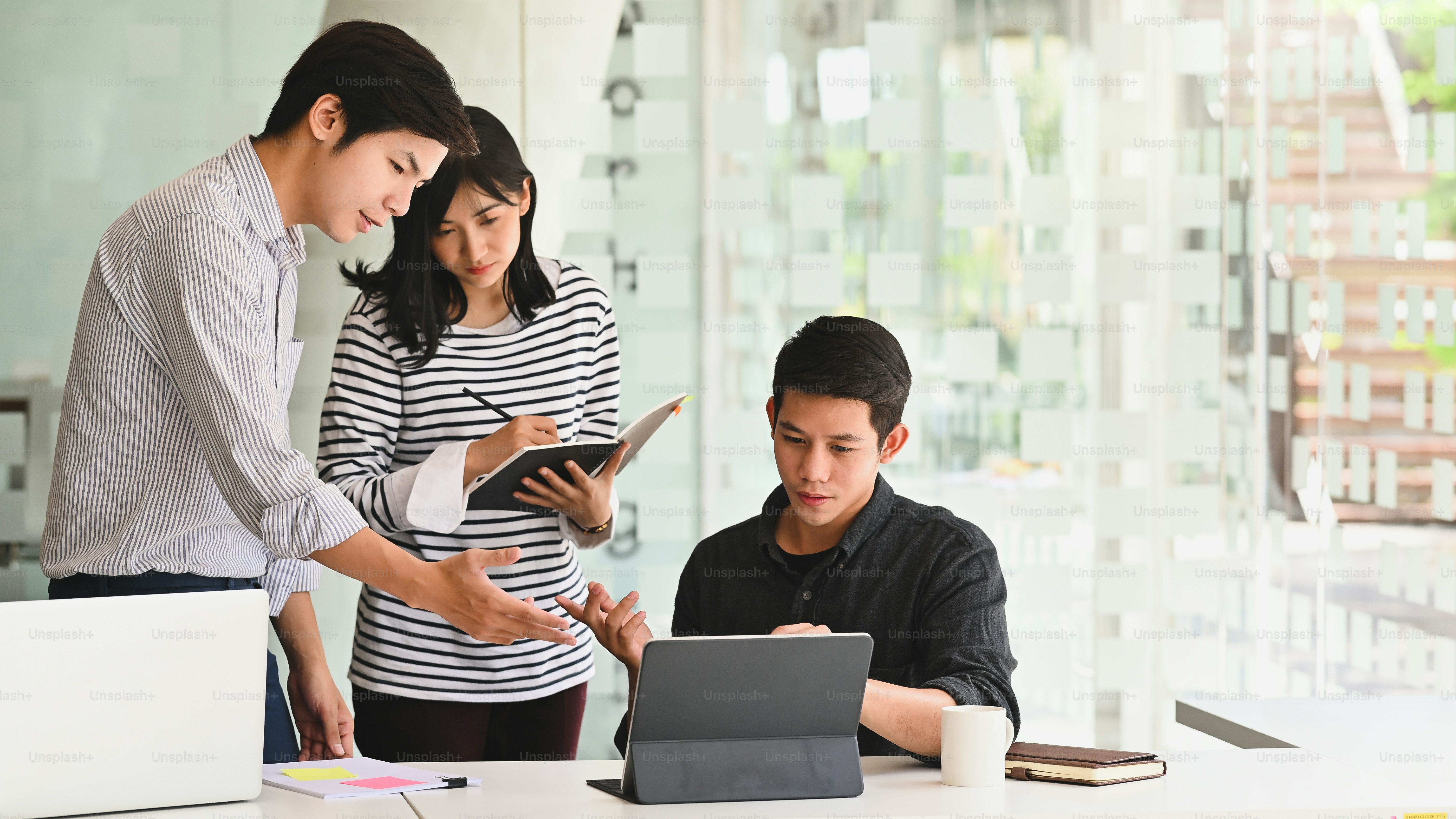 Startup business discussion with tablet in modern office. photo – Table ...