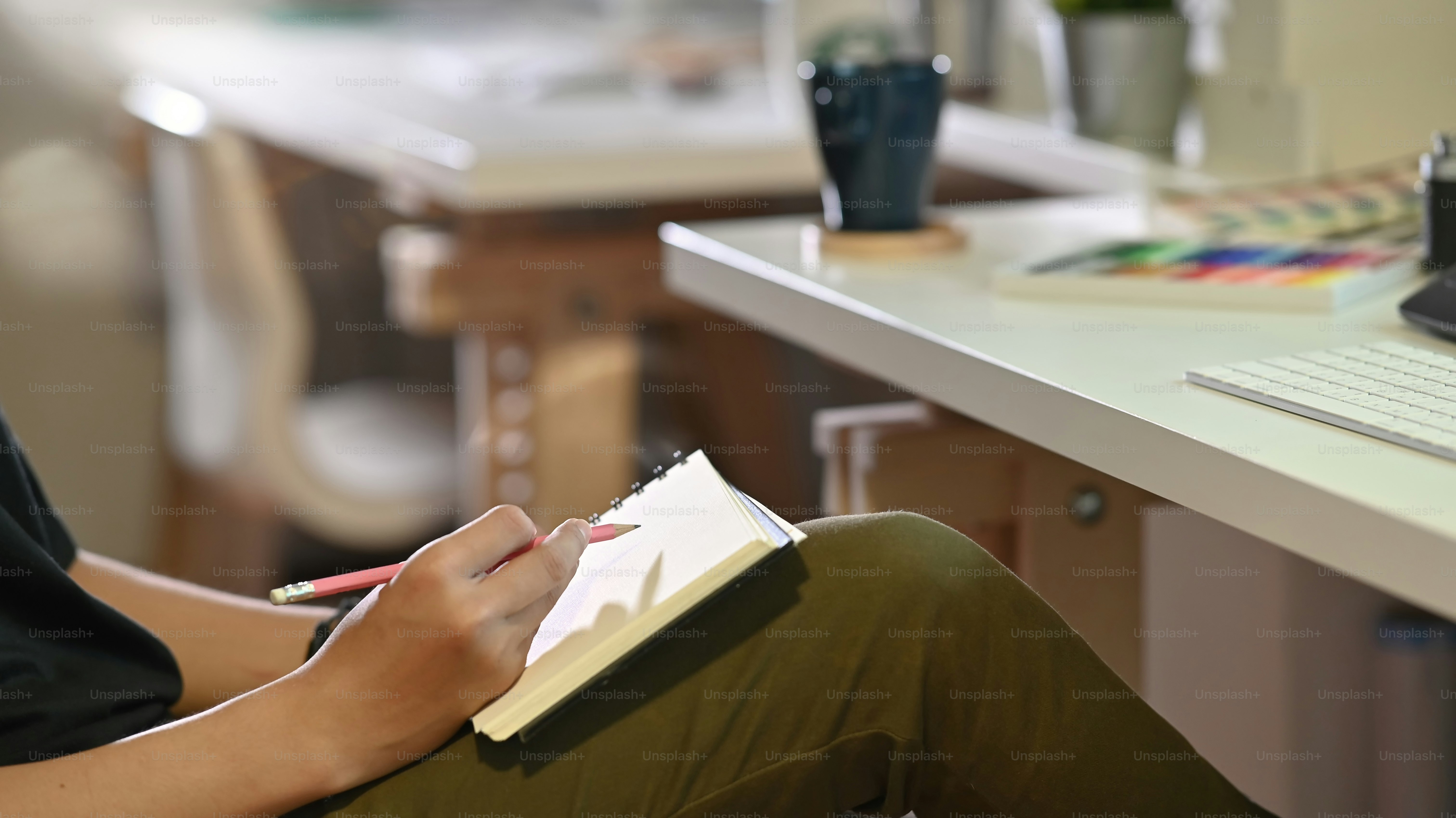 Closeup young creative man drawing on paper. photo – Thailand Image on ...