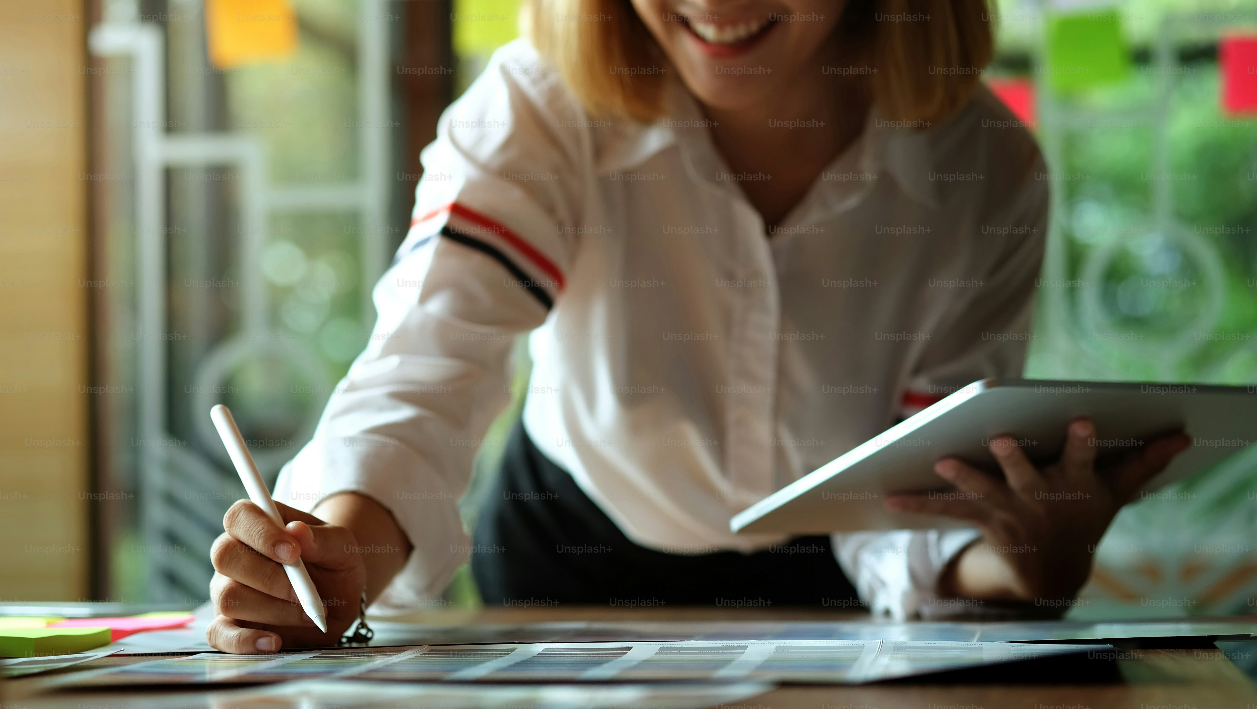 Cropped shot young graphic designer working with tablet and stylus and ...