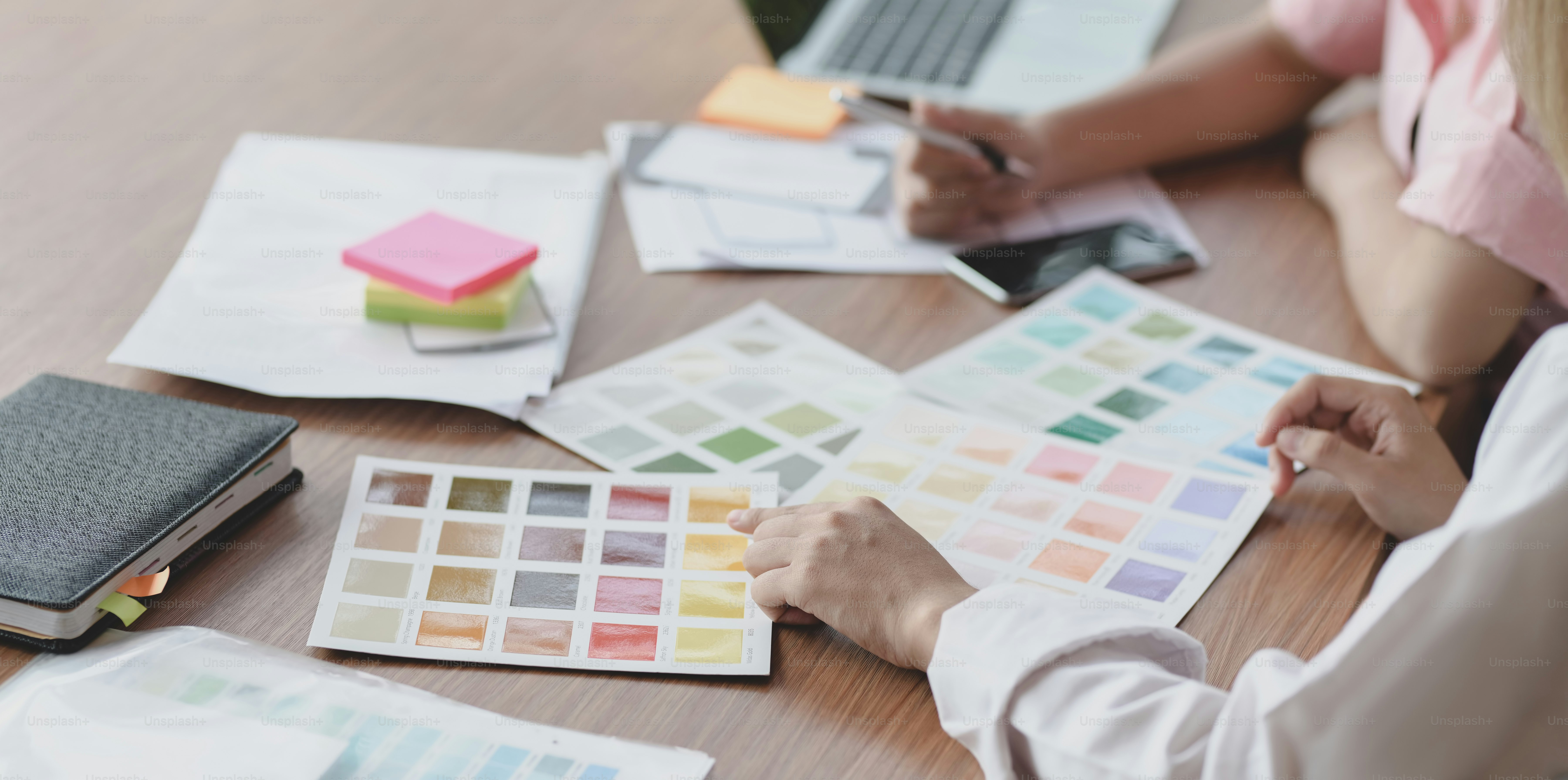 Close-up view of young team professional UI graphic designer discussing ...