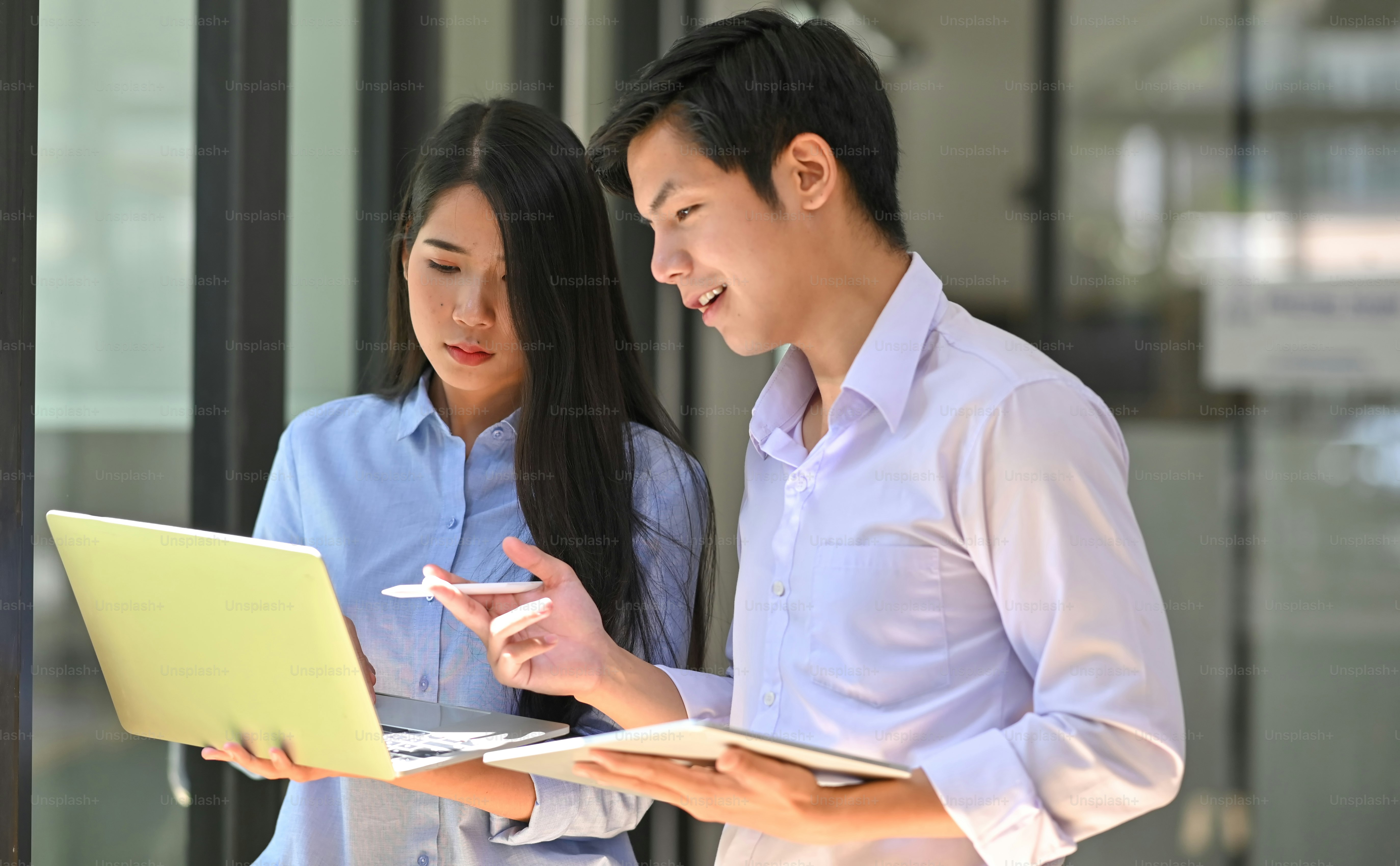 Together young friend consulting's they laptop and tablet. photo ...