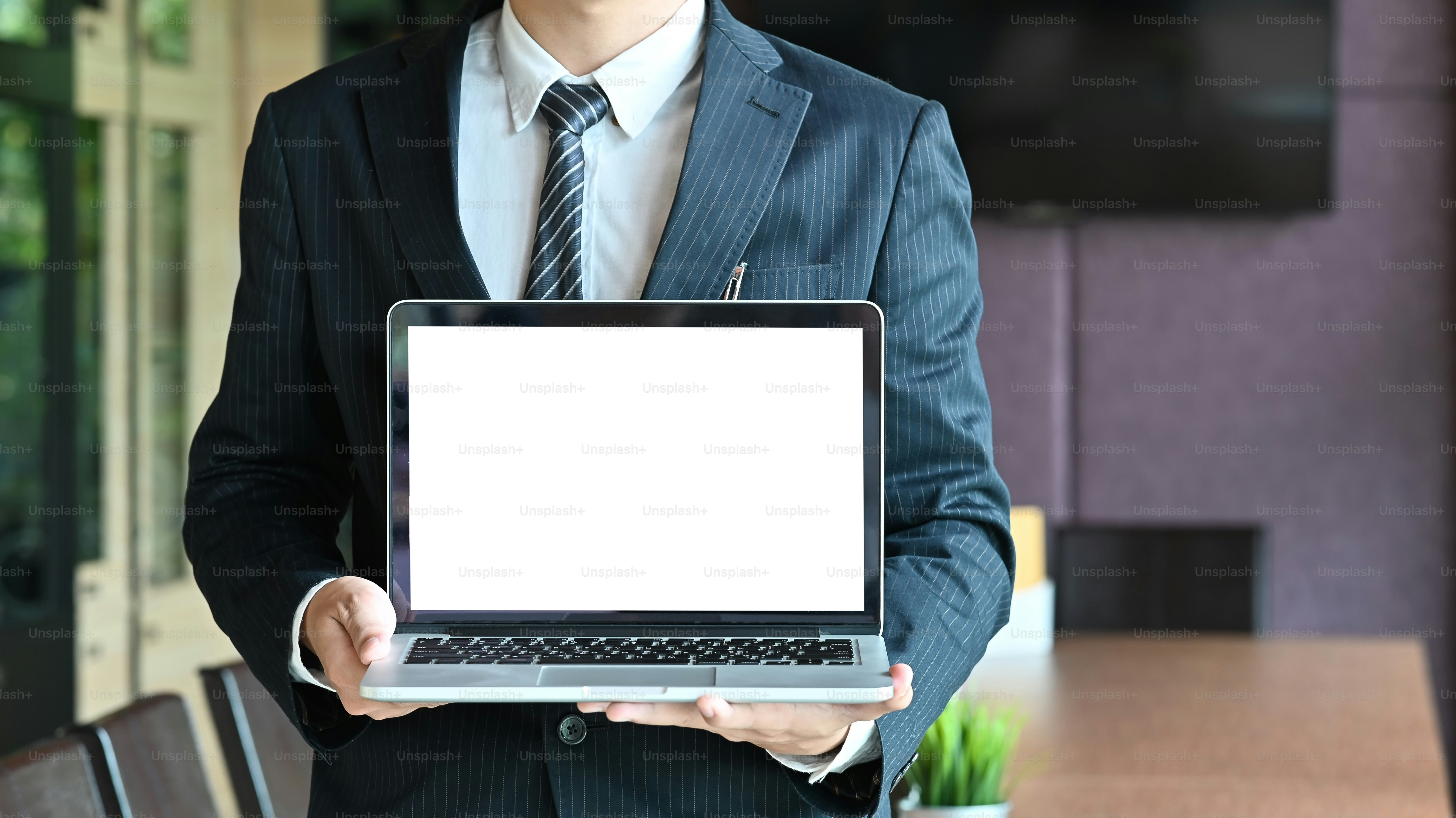 Cropped shot man in suit showing isolated laptop computer front of ...