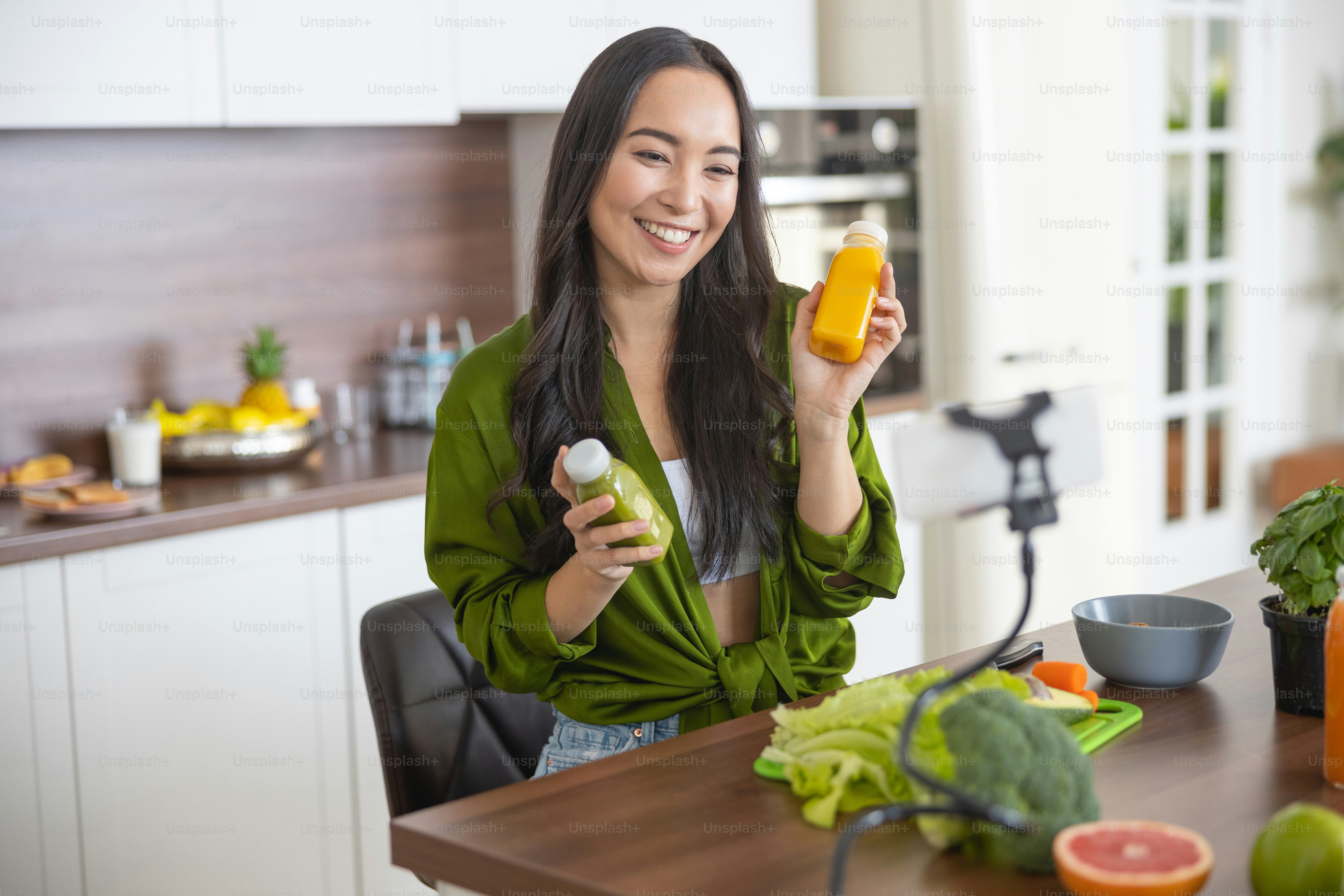 Cute woman with glass bottles of sauces smiling at her fans photo – Vegetable Image on Unsplash