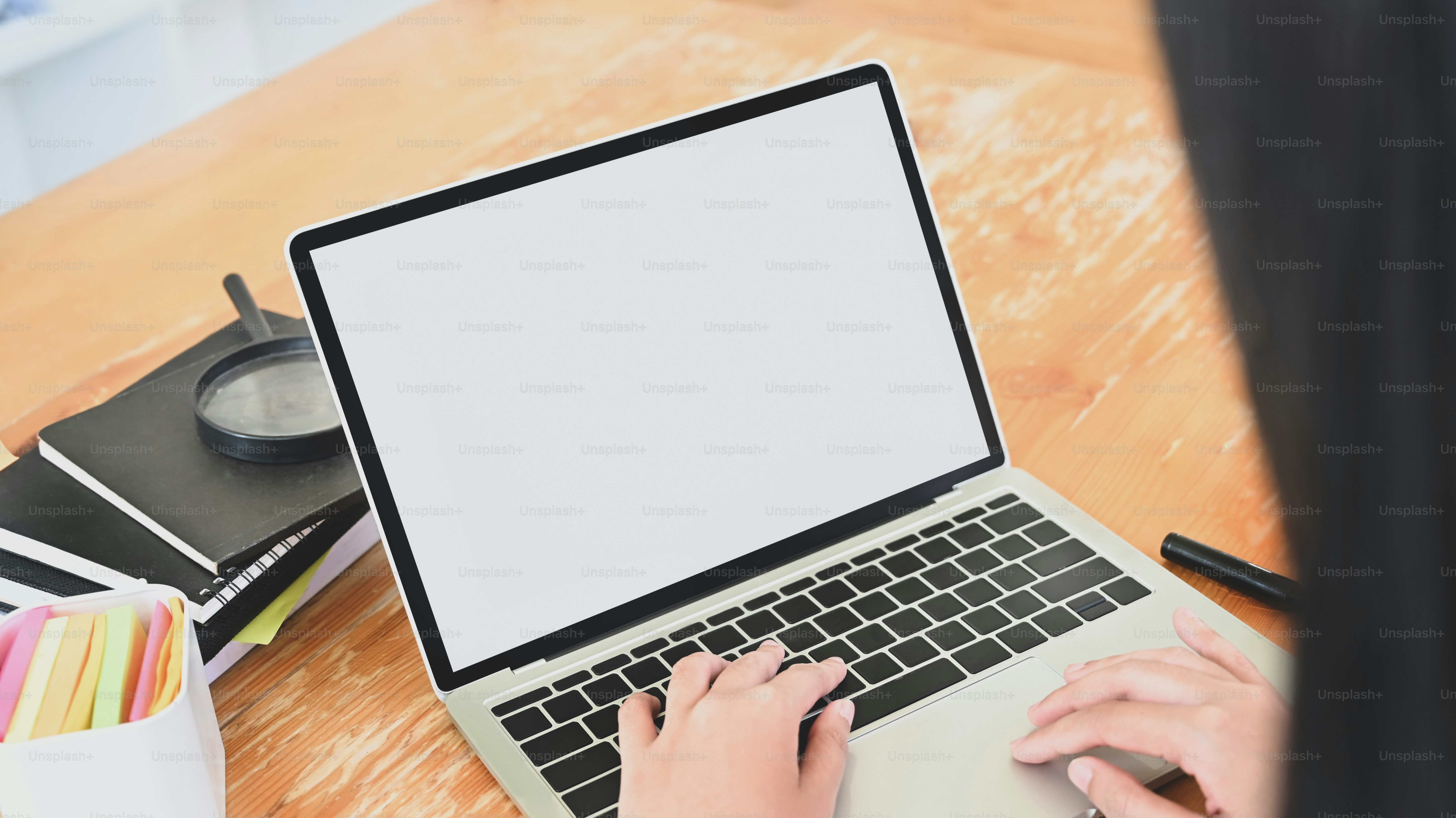 Close-up young woman typing laptop computer with empty screen photo ...