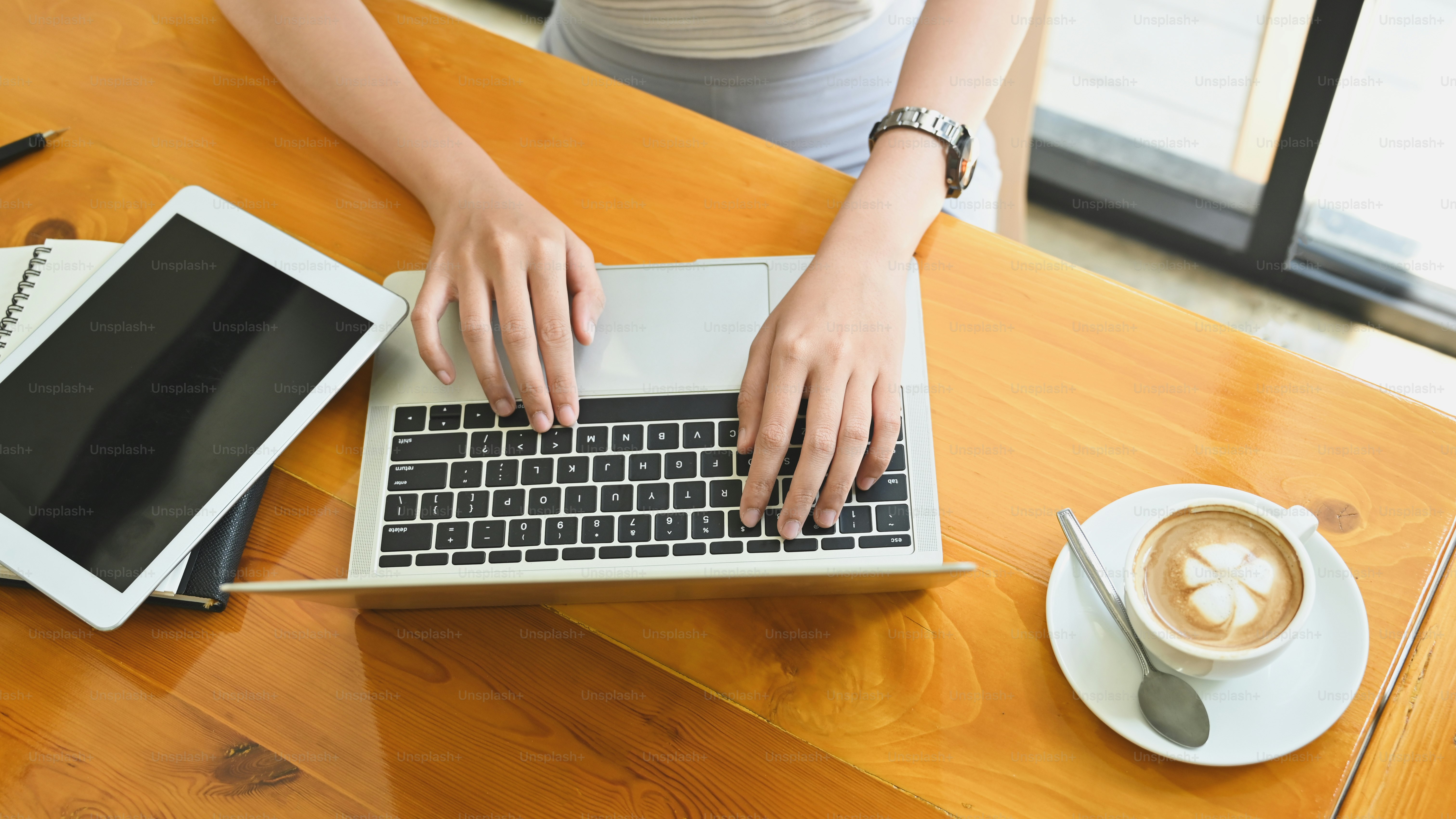 Above top view female using laptop computer with coffee latte. photo ...