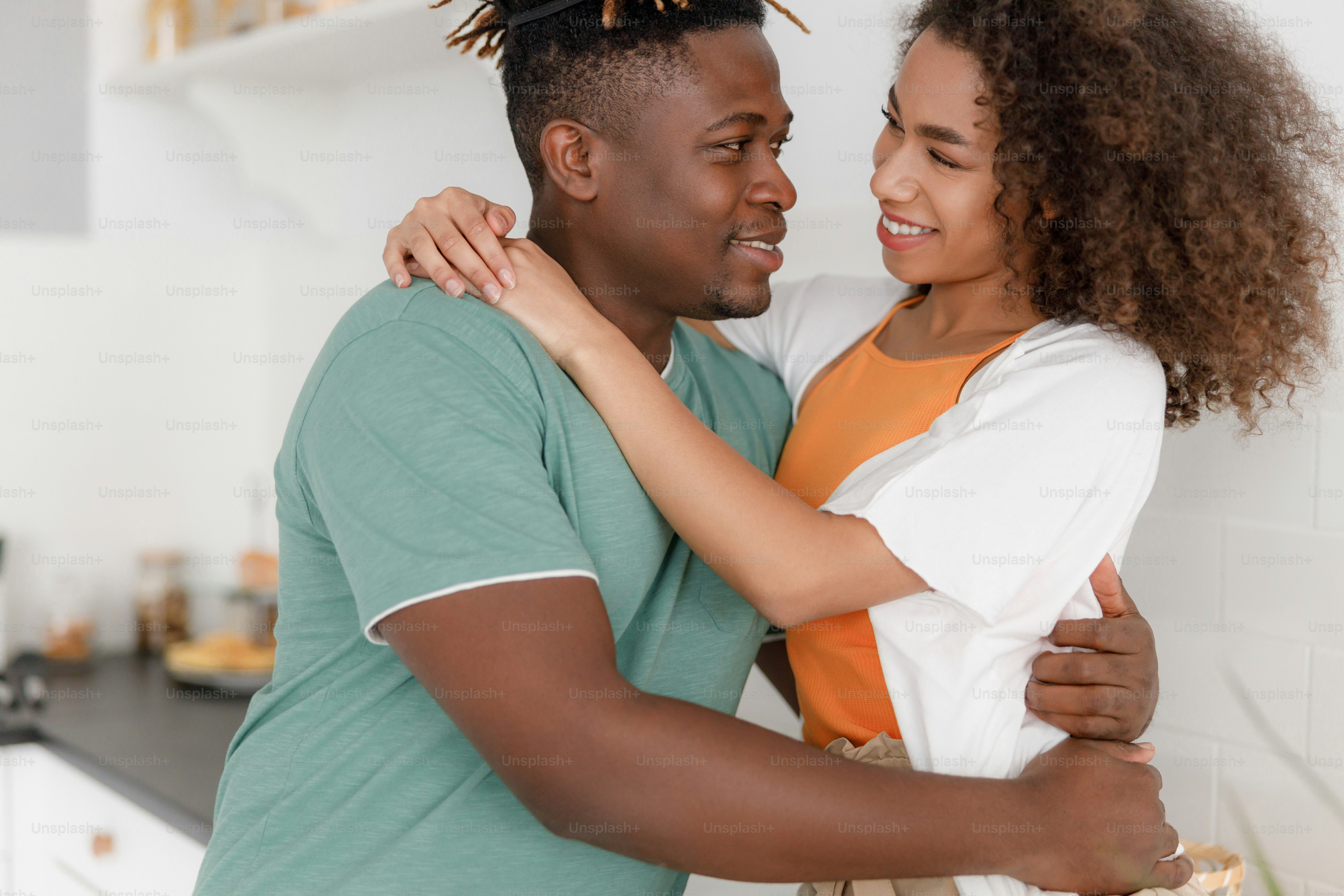 Happy loving couple cuddling and smiling stock photo photo – People ...