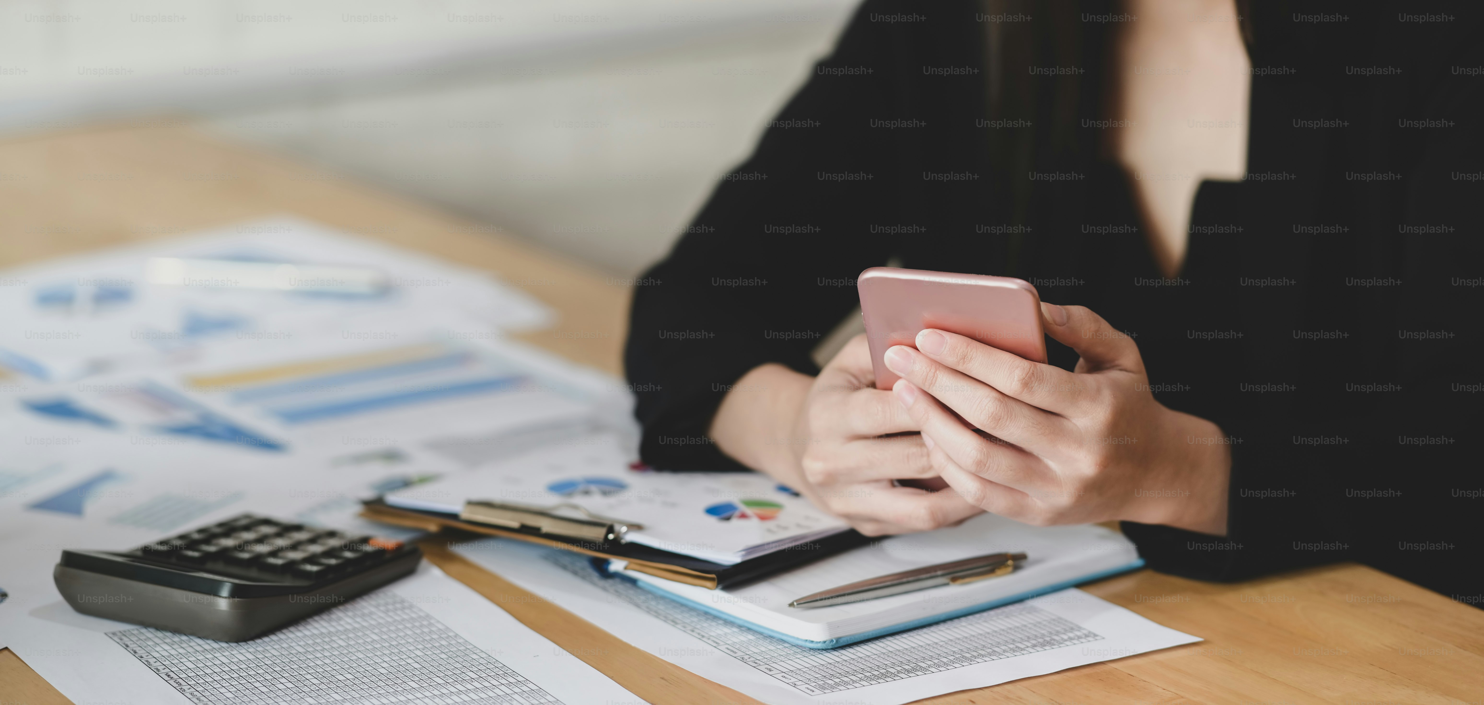 Cropped shot of young professional accountant summarising current ...