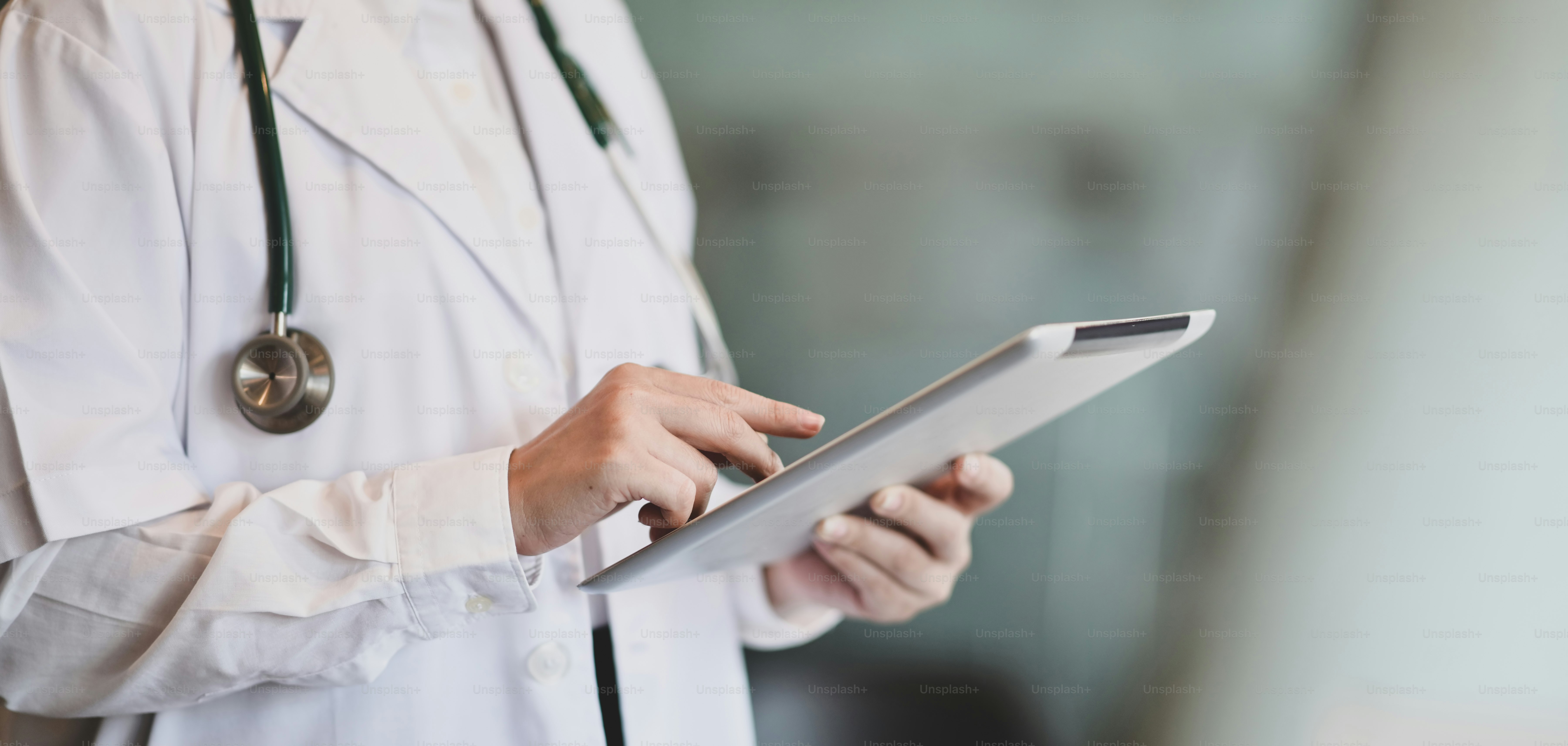 Cropped shot of young female doctor summarises patient charts with ...