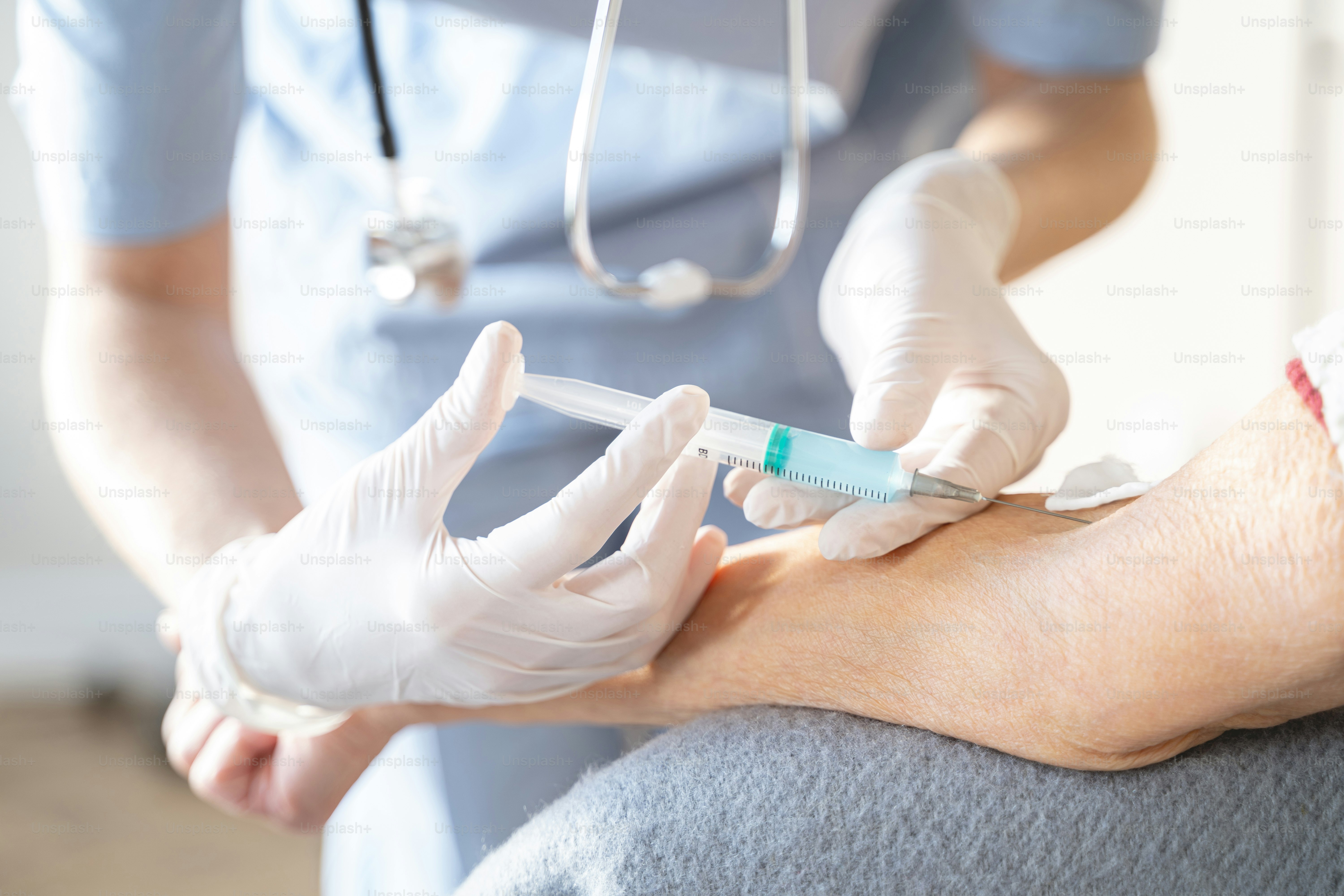 Competent medical worker using sterile instrument while treating her ...