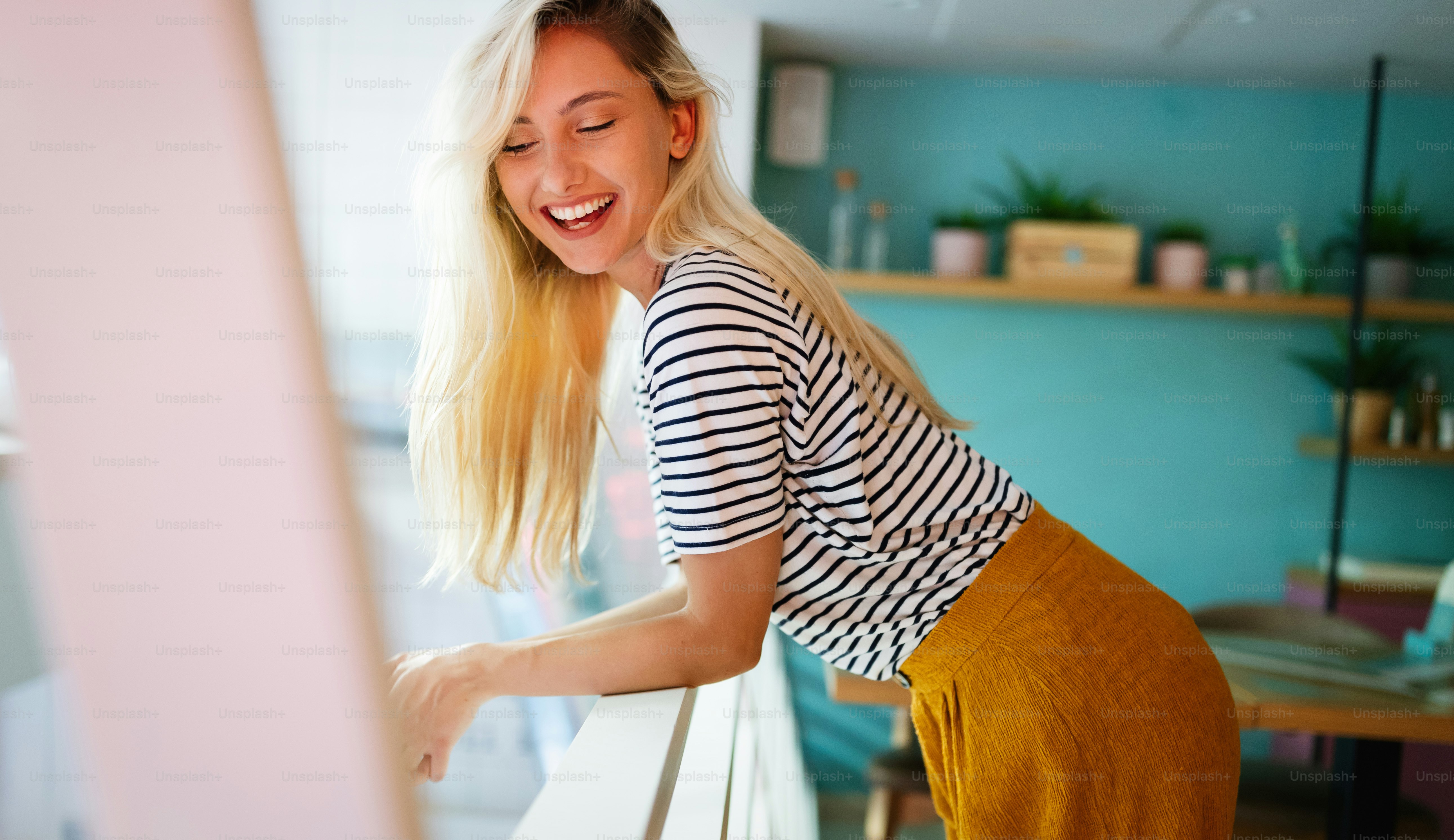 Portrait of beautiful young happy woman, student smiling and having fun ...