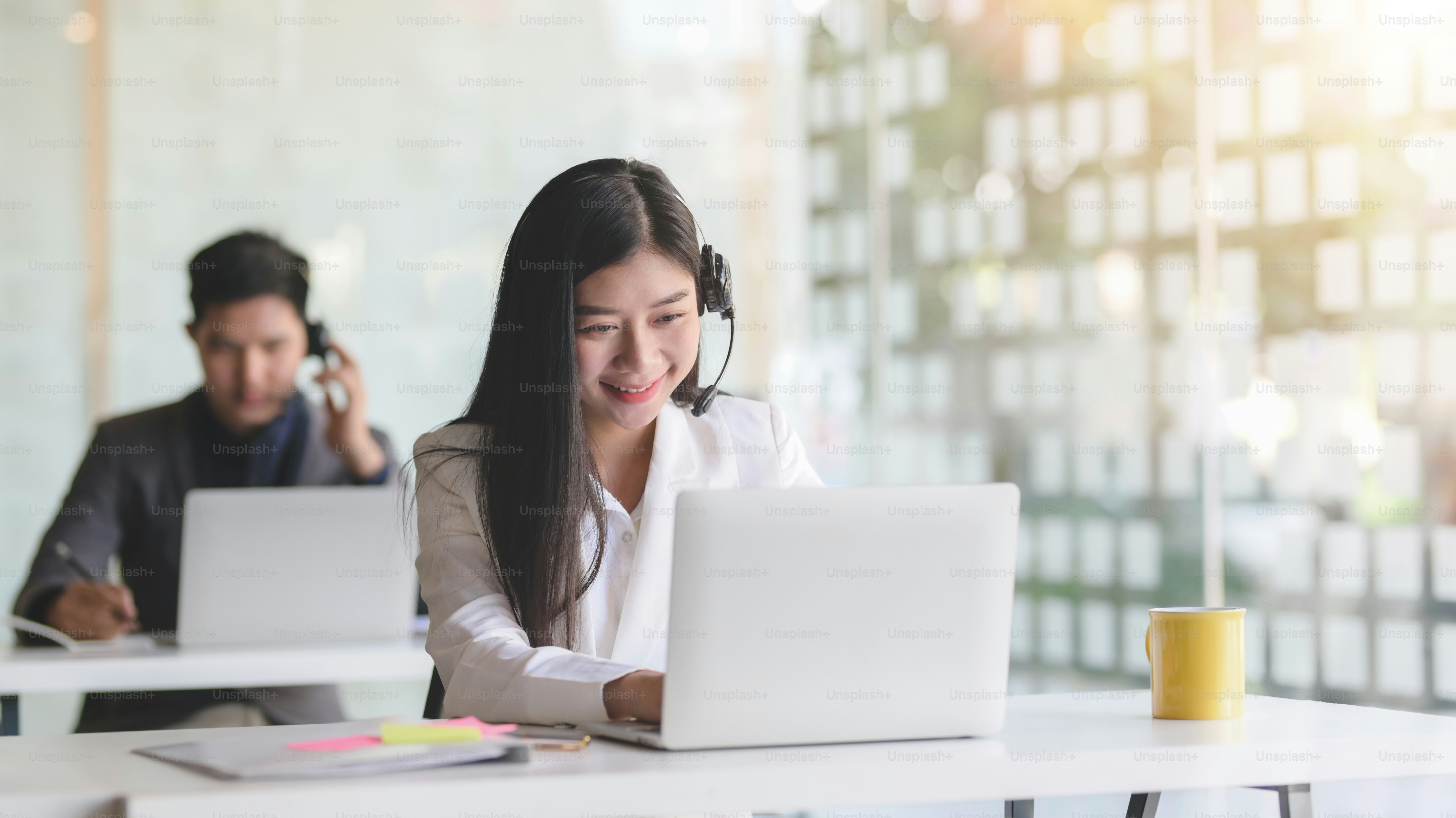 Close up view of customer service talking on headset with smiling to ...