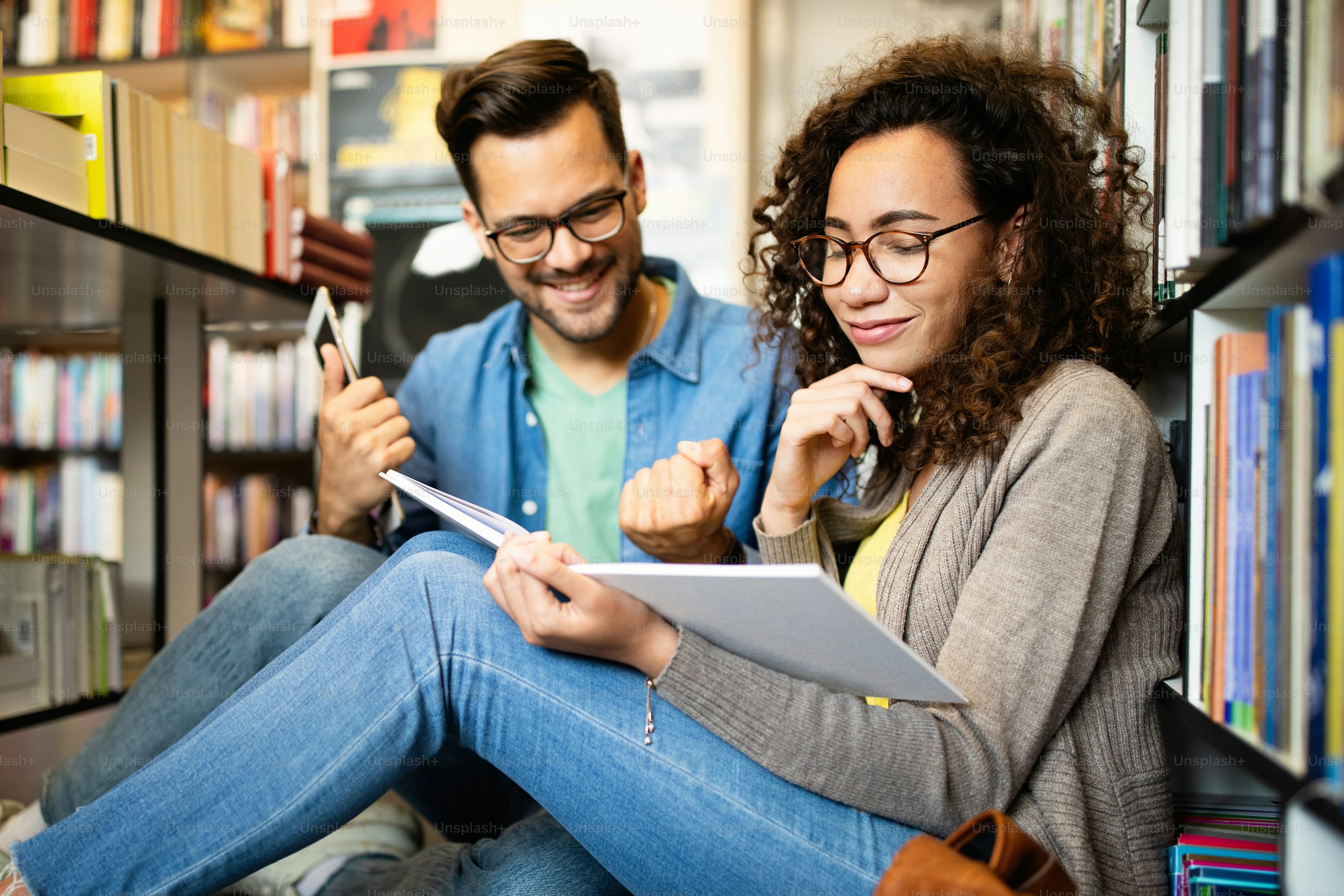 Happy young university students studying together. Group of multiracial ... Happy young university students studying together. Group of multiracial ...