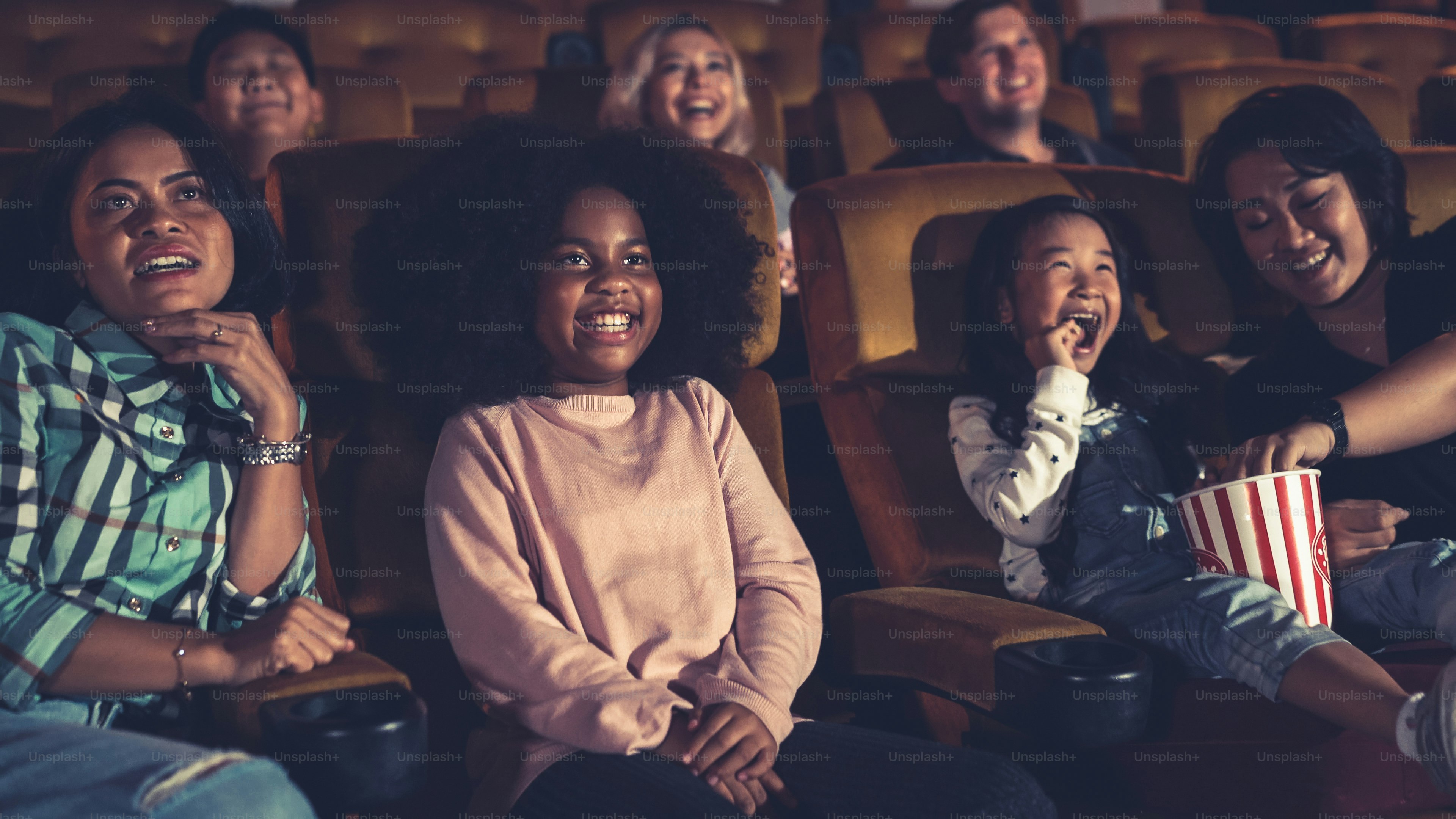 People audience watching movie in the movie theater cinema. Group ...