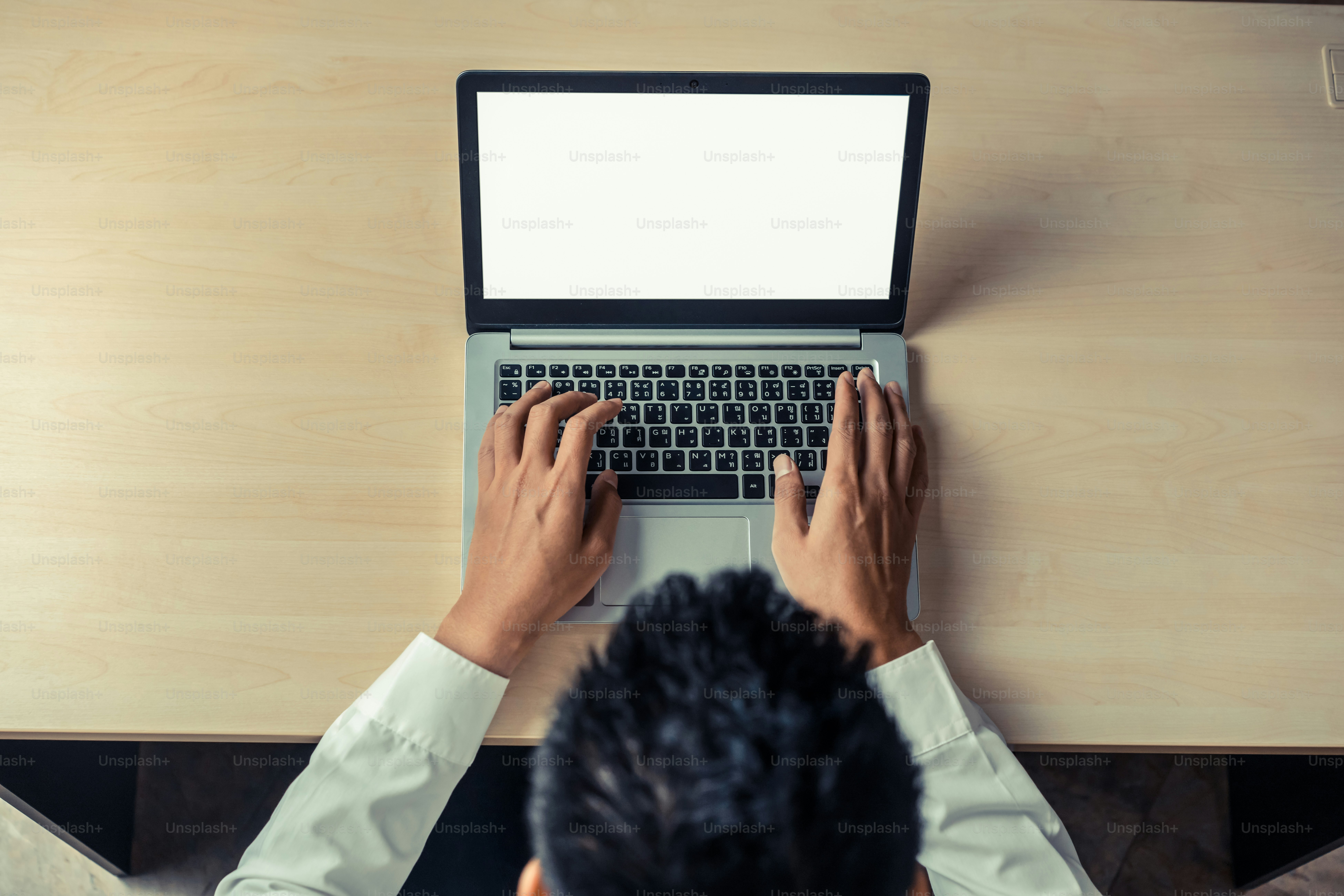 Business person or office worker using laptop computer while sitting at ...