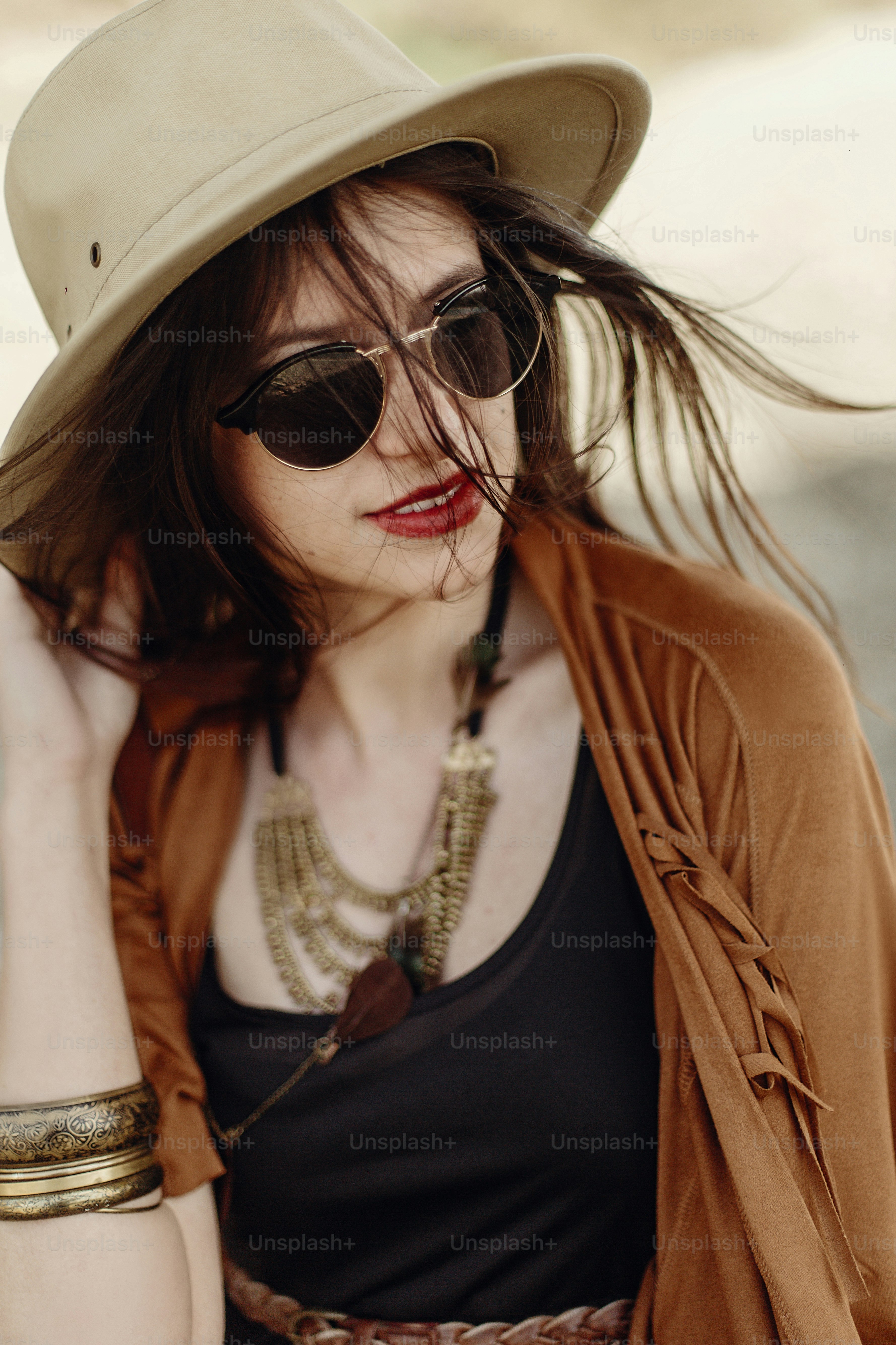 Stylish hipster woman having fun and smiling, in hat with windy hair ...